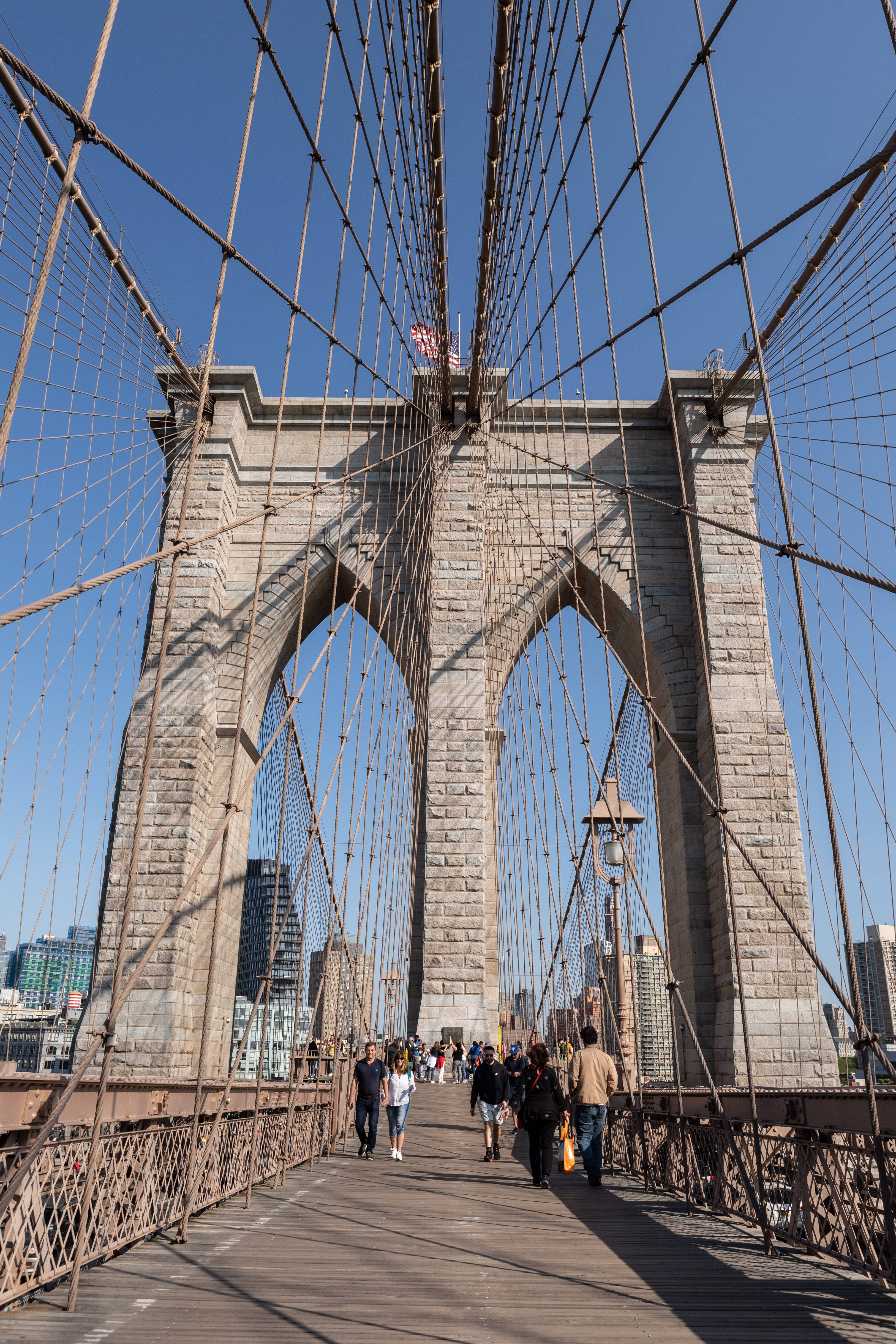 Brooklyn Bridge Arches with Pedestrians in New York · Free Stock Photo