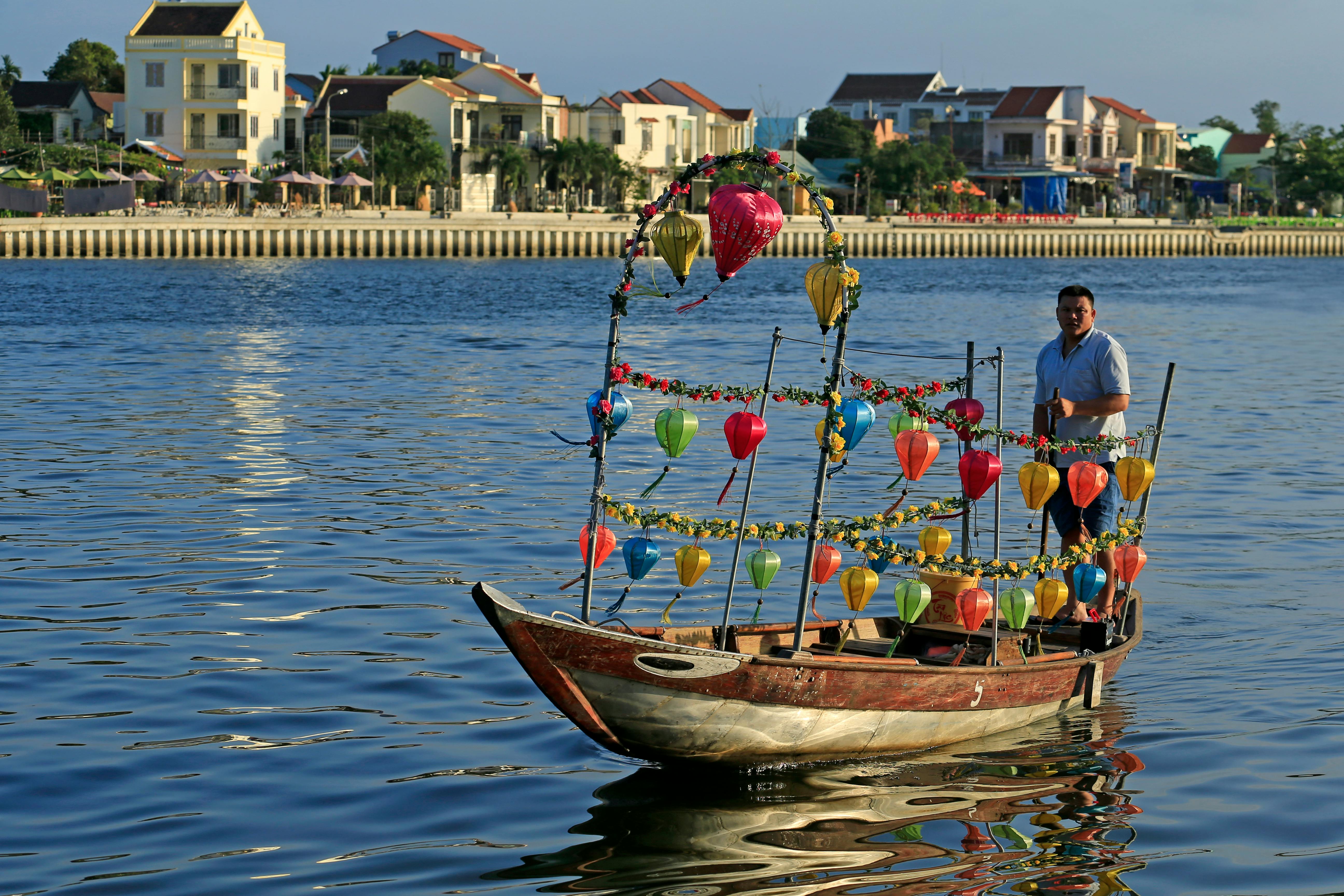 Colorful Lantern Boat on Calm Urban River · Free Stock Photo