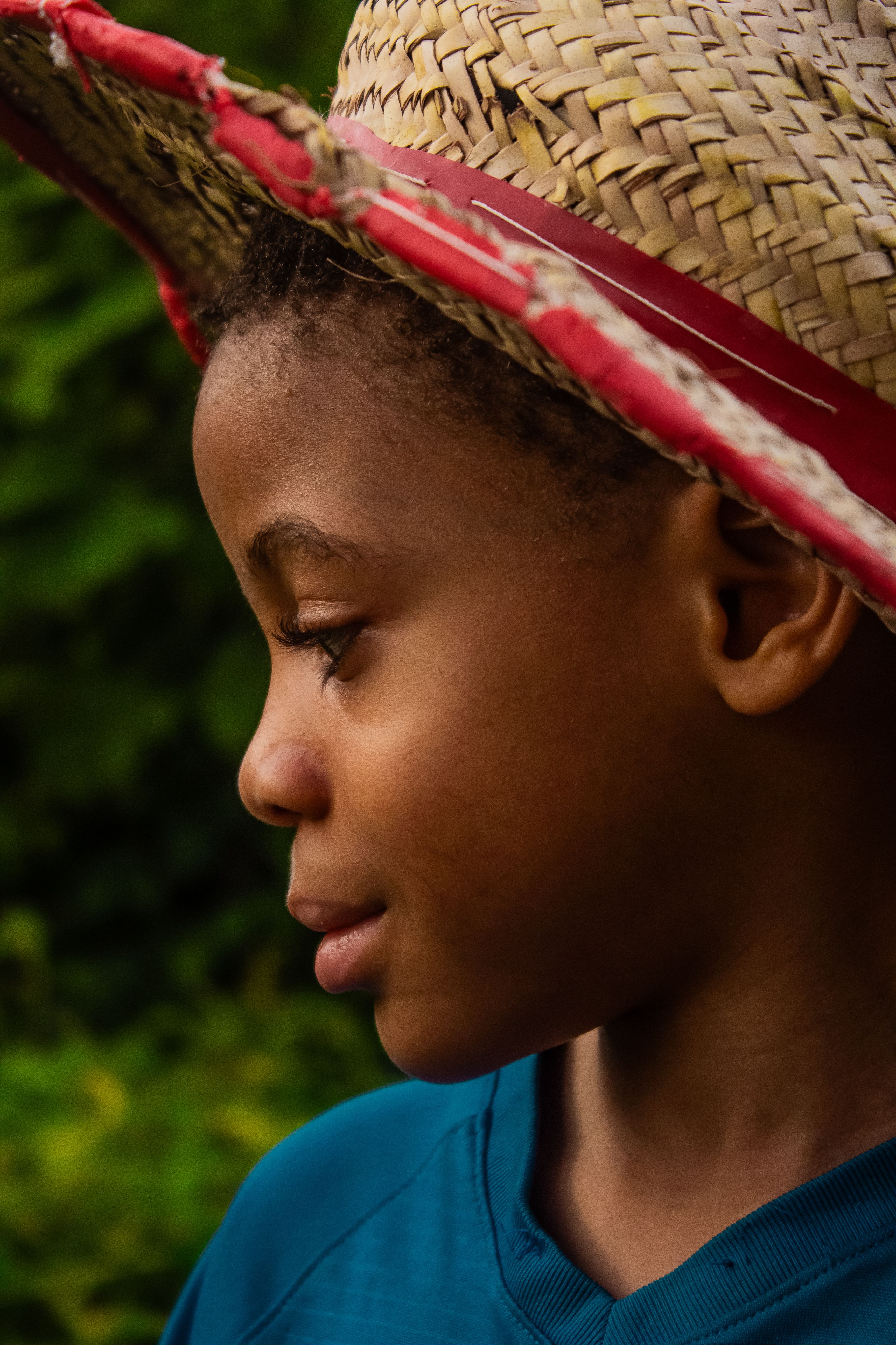 Portrait of a Child in Straw Hat Outdoors · Free Stock Photo