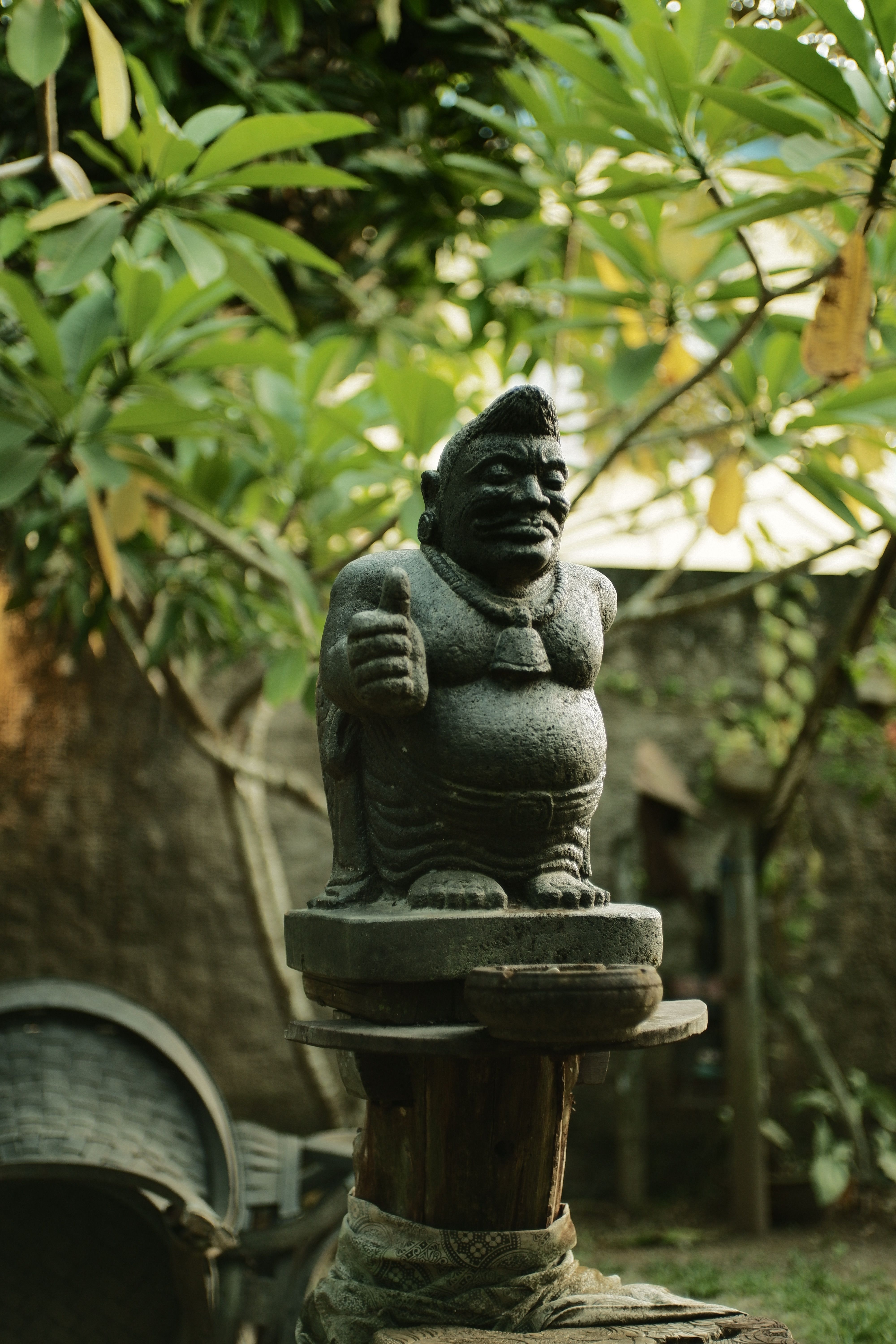 Peaceful Buddha statue amidst lush greenery outdoors · Free Stock Photo