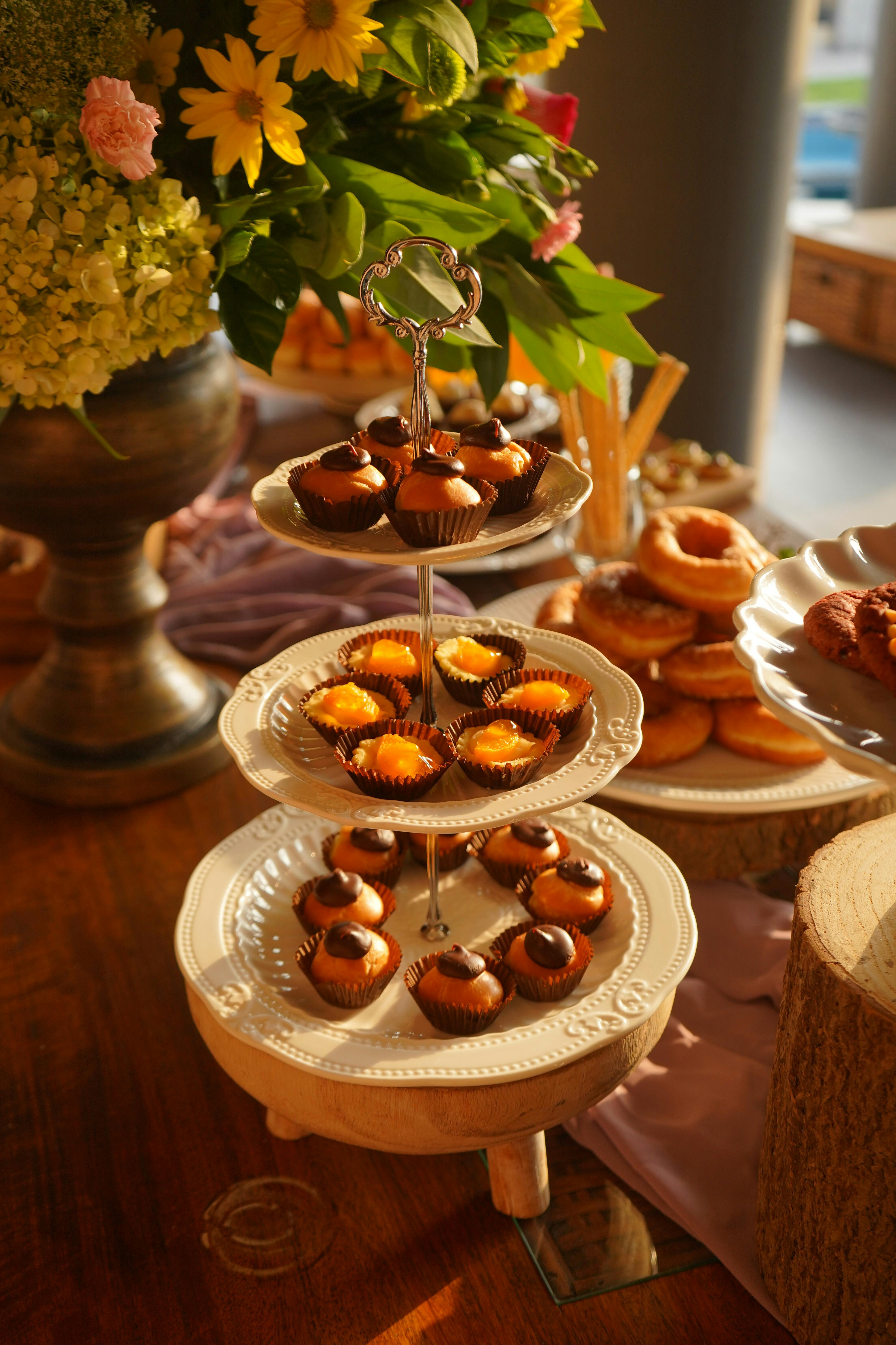 Elegant Dessert Table with Flowers and Pastries · Free Stock Photo