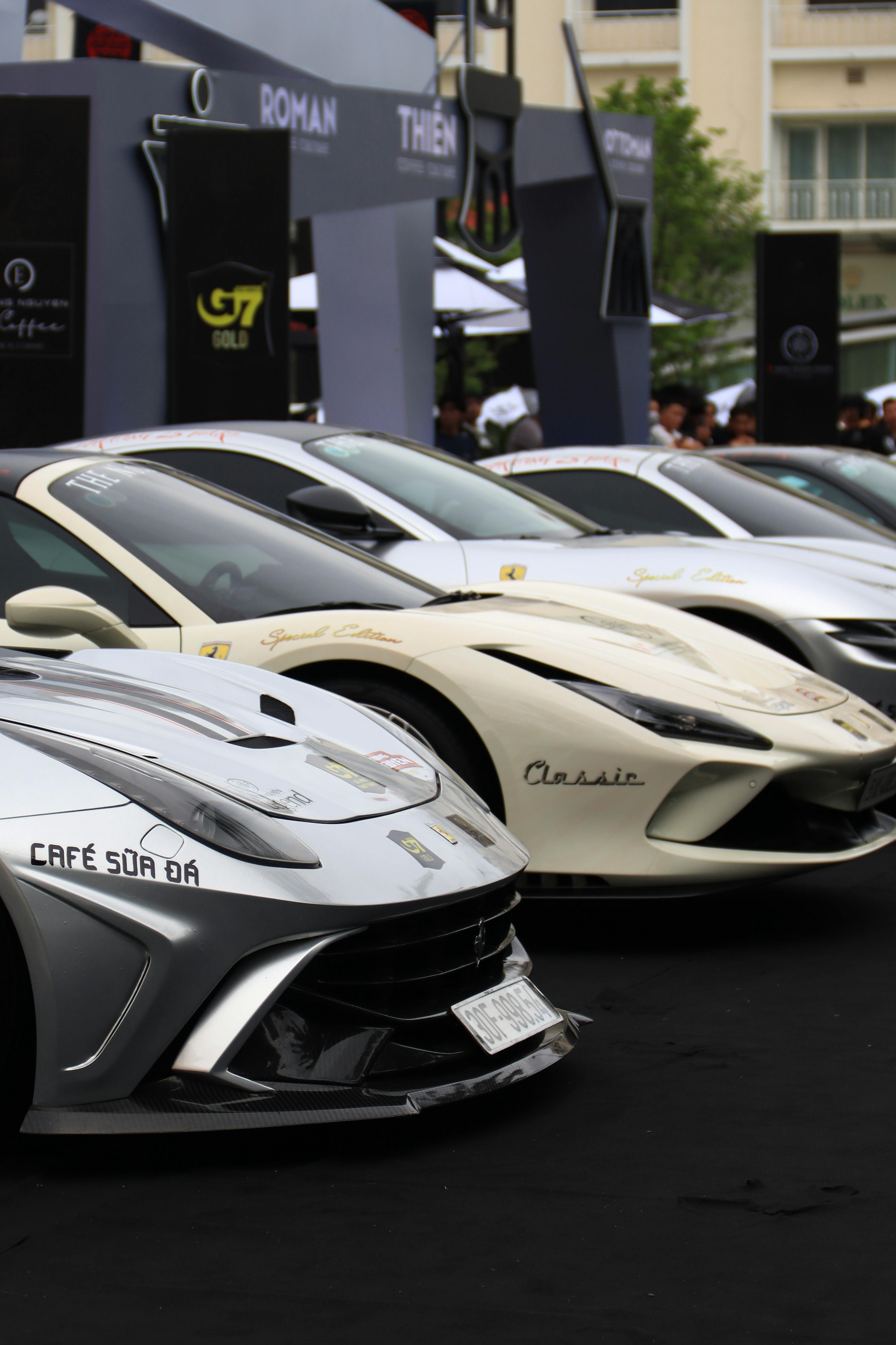 Luxury Sports Cars Display at Auto Show · Free Stock Photo