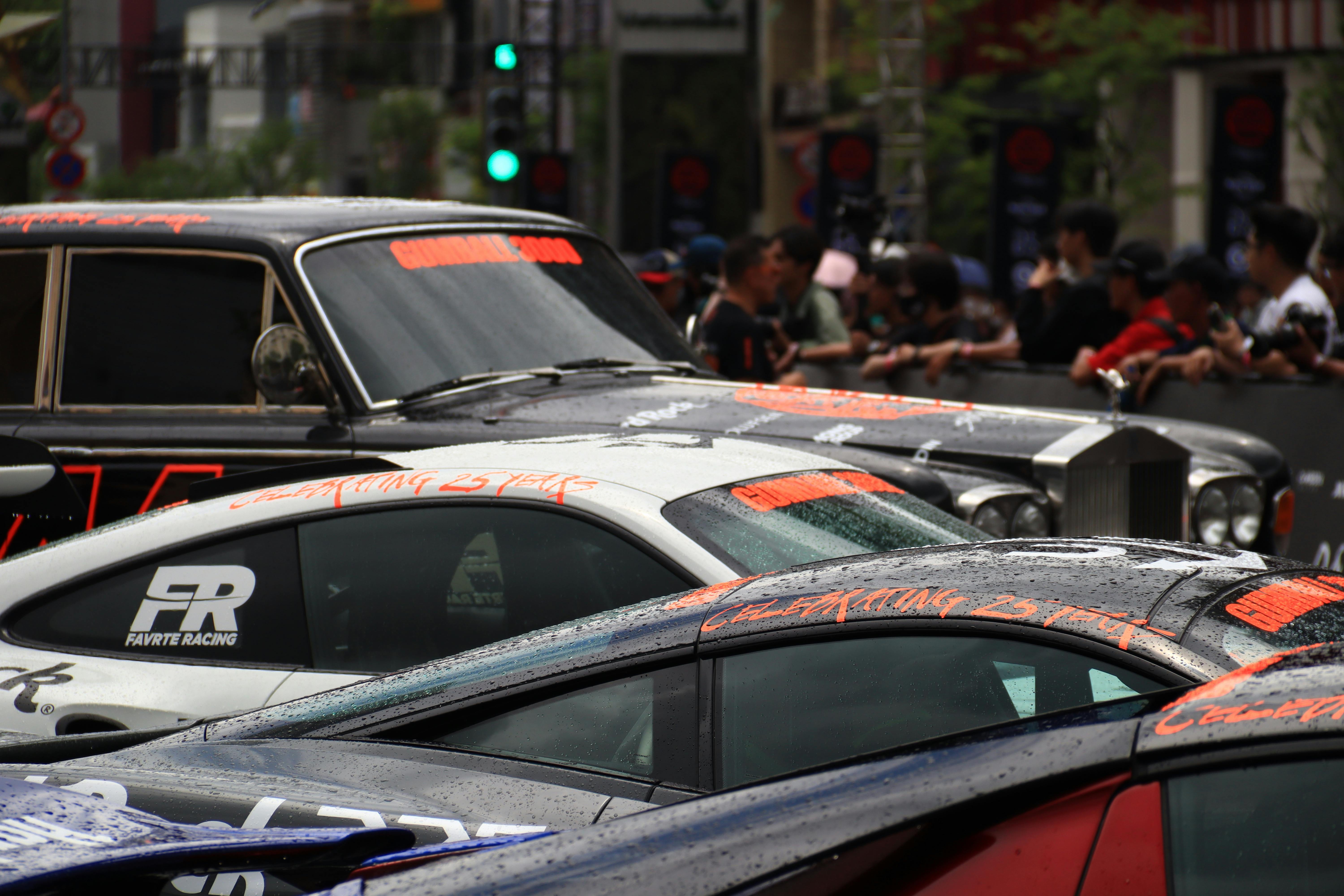 Exciting Street Racing Event with Sports Cars · Free Stock Photo