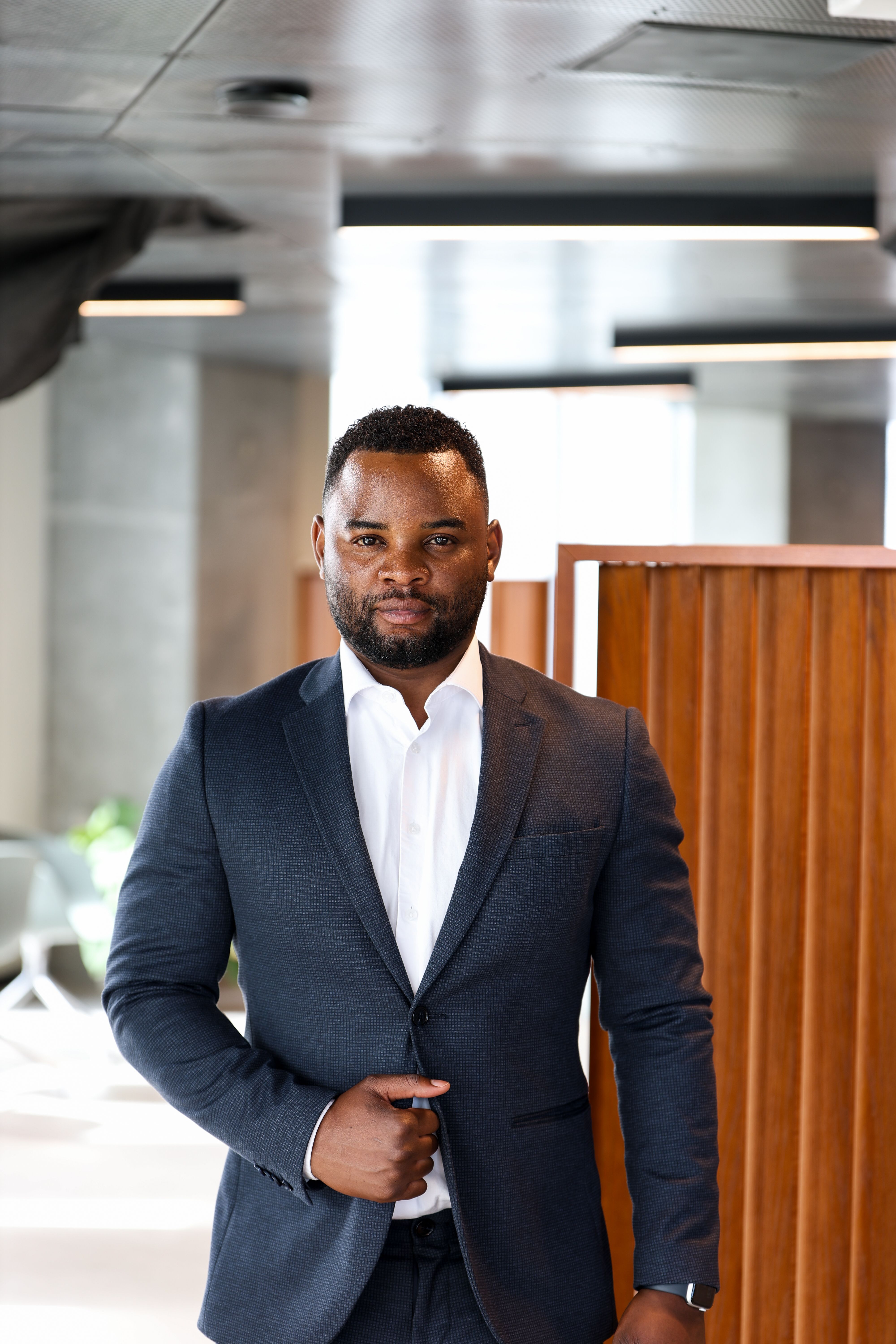 Professional Man in Business Suit in Modern Office · Free Stock Photo