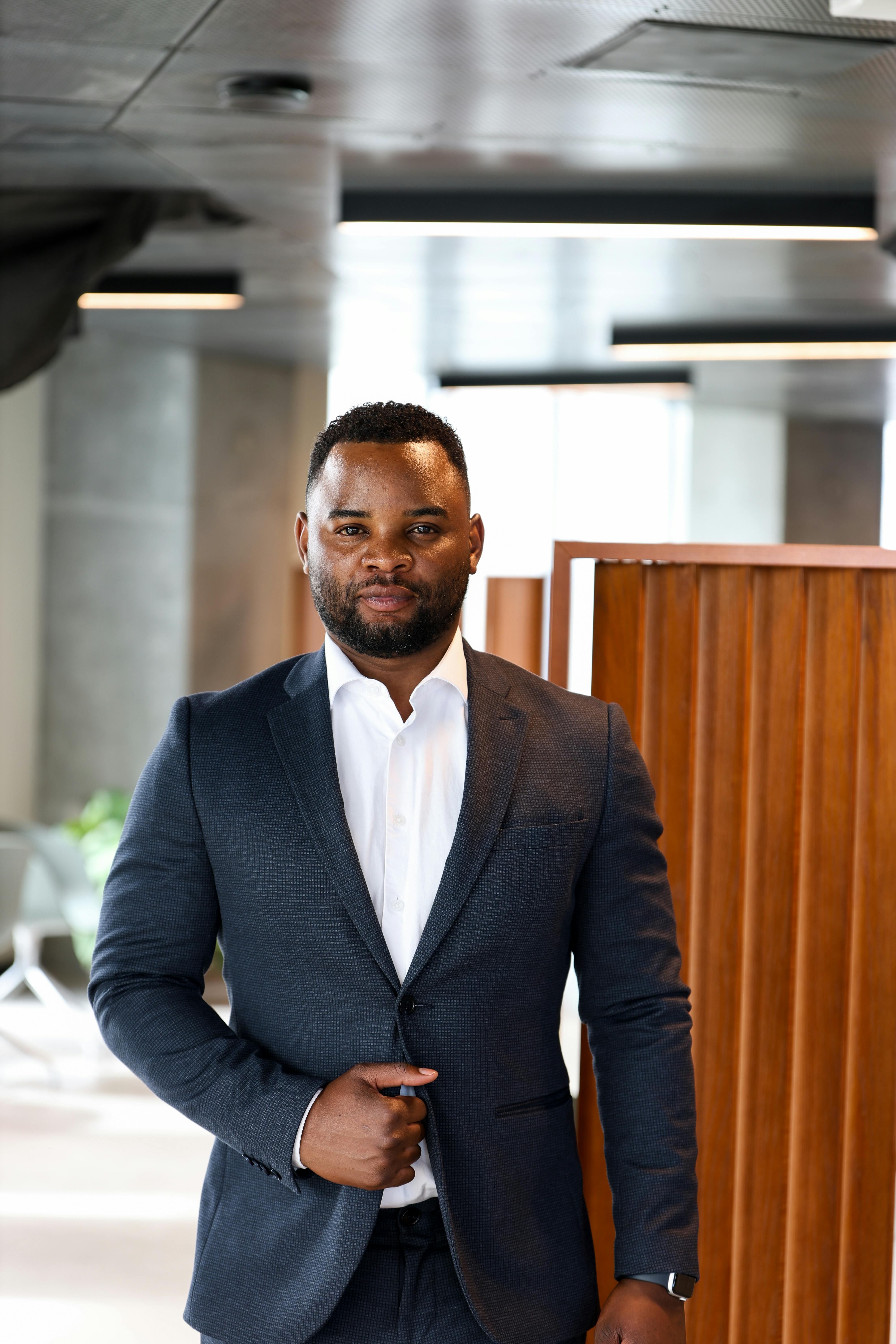 Professional Businessman Posing Indoors · Free Stock Photo