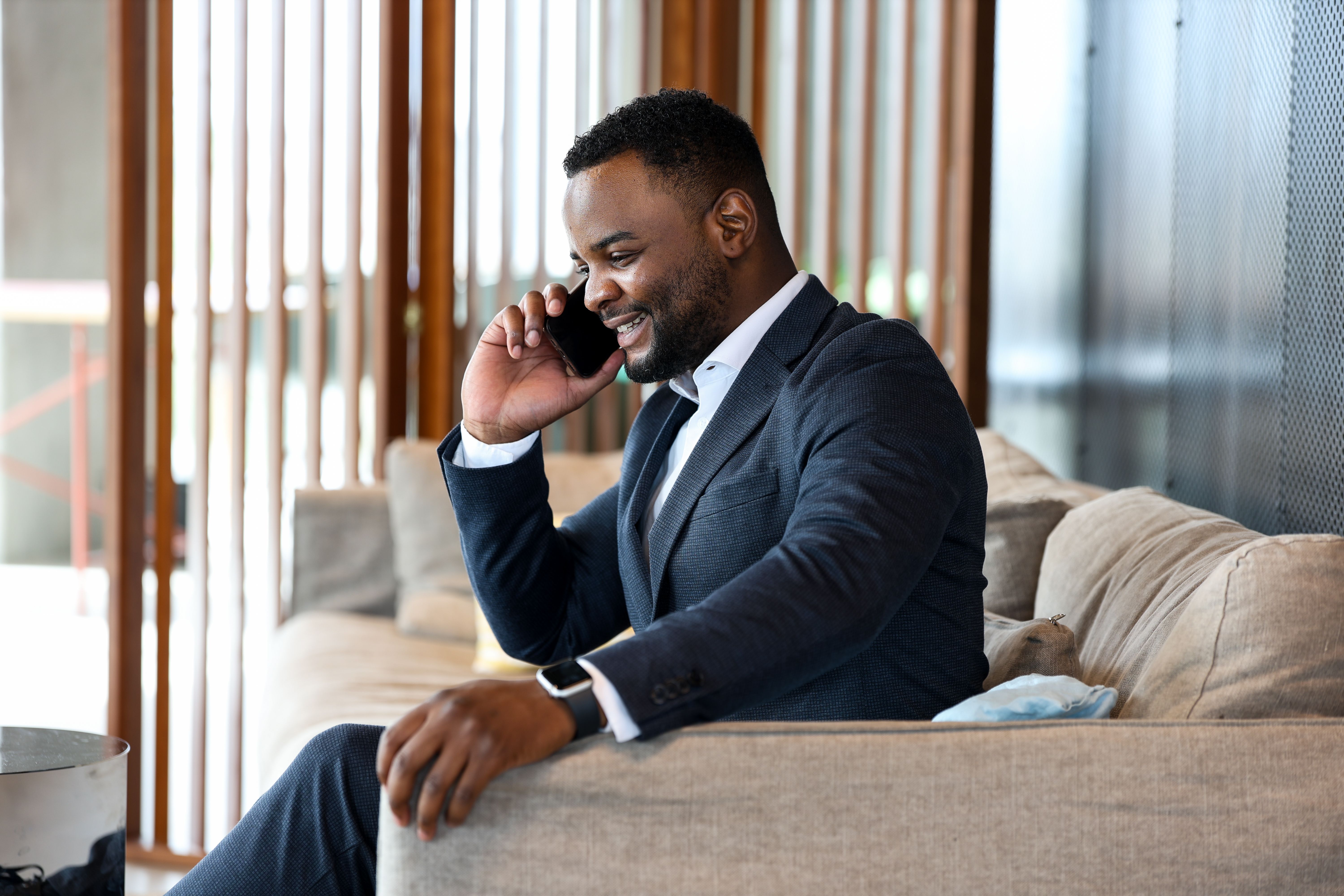 Business Professional Talking on Phone Indoors · Free Stock Photo
