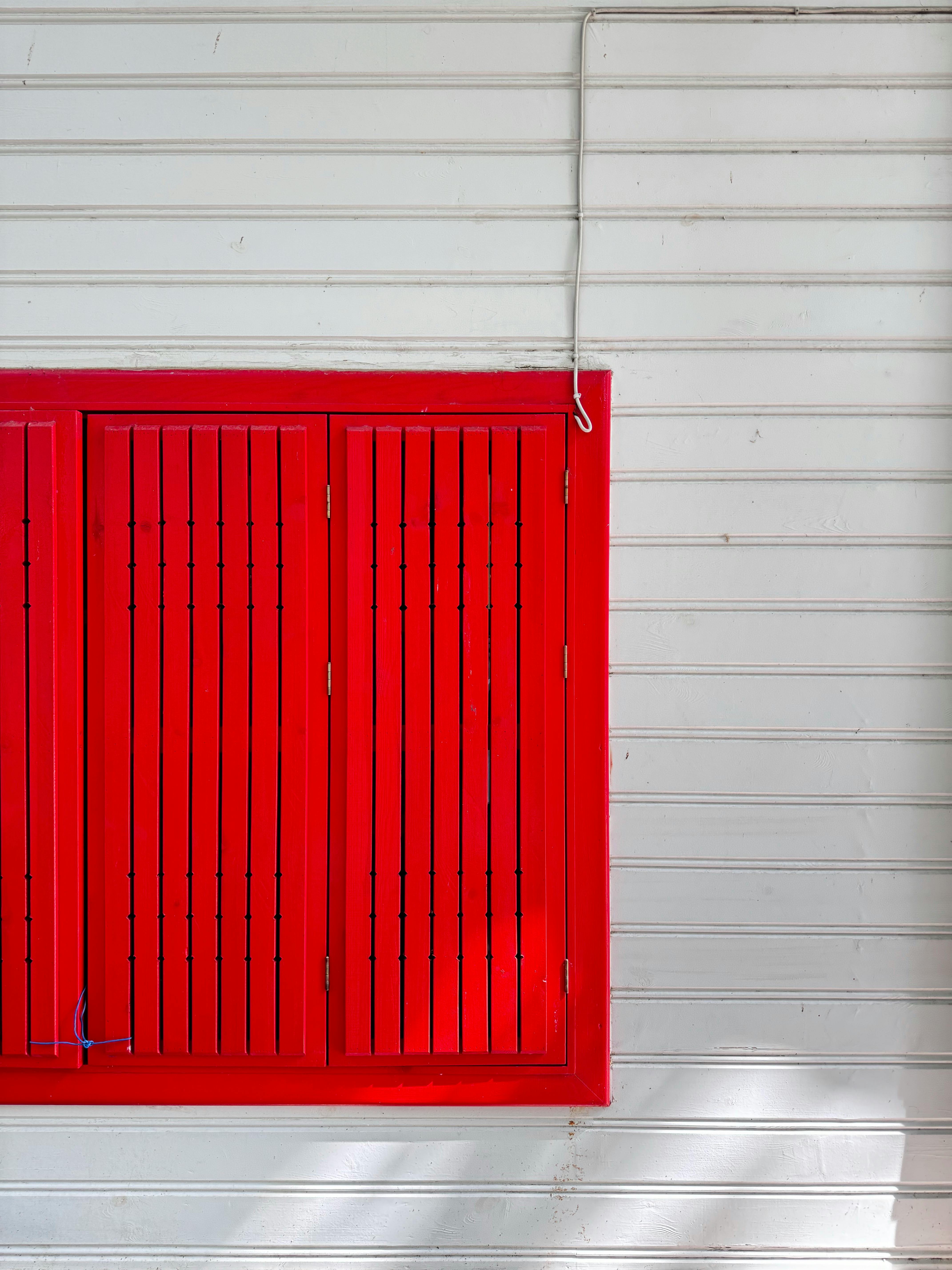 Minimalist Red Window on White Wall Exterior · Free Stock Photo