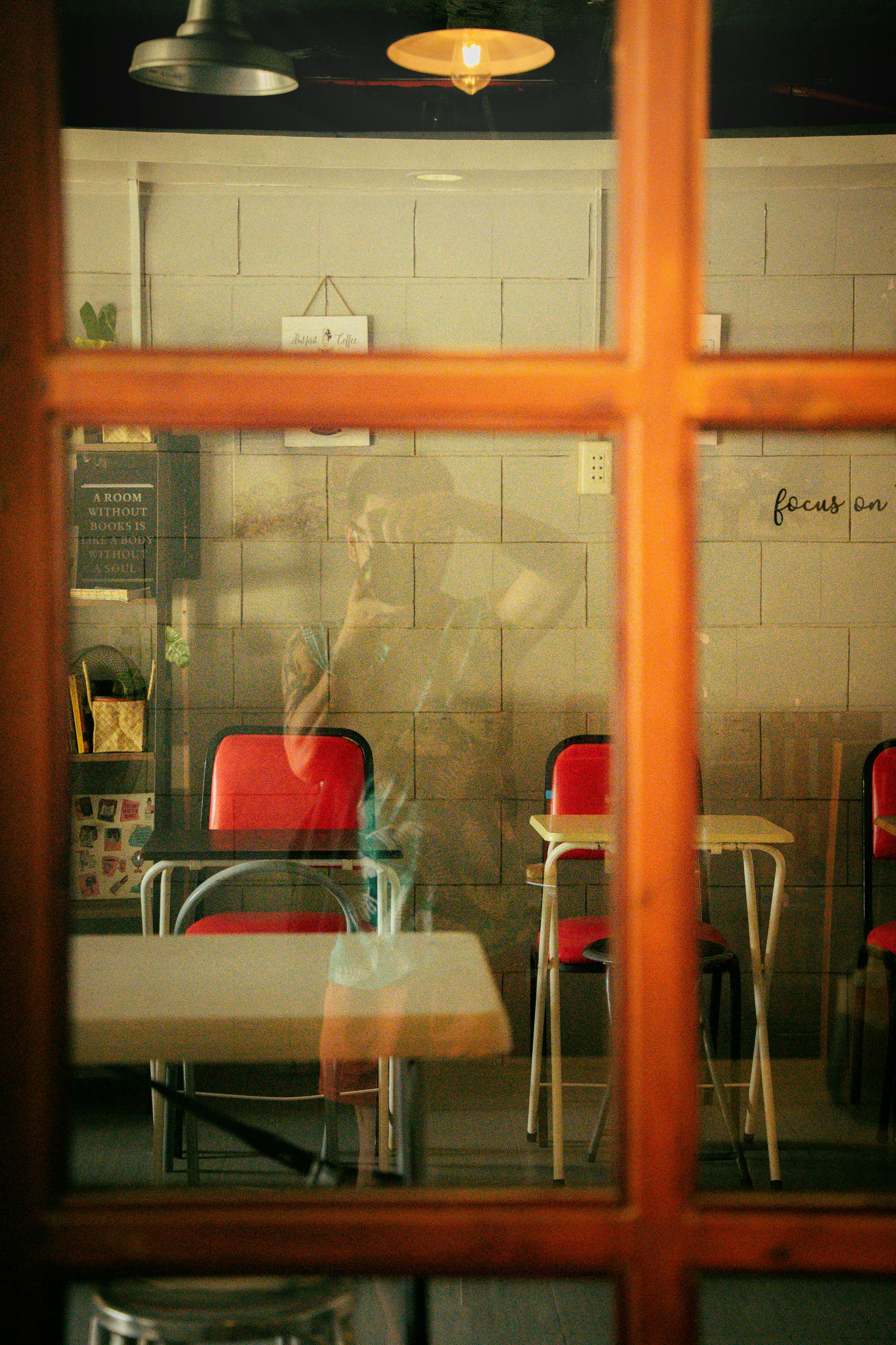 Indoor Cafe Reflection with Vintage Ambiance · Free Stock Photo