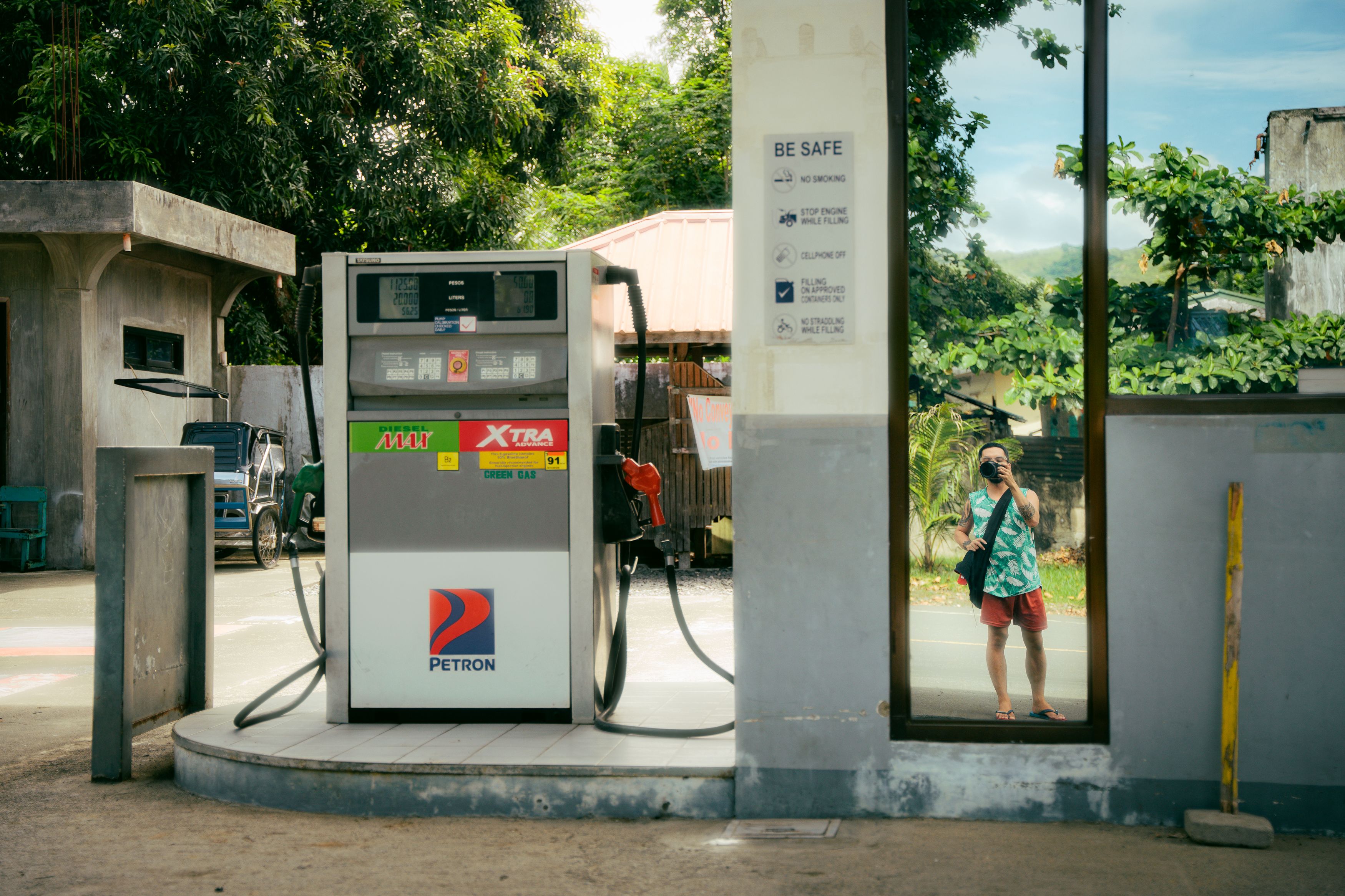 Reflection at a Petron Gas Station in Rural Setting · Free Stock Photo
