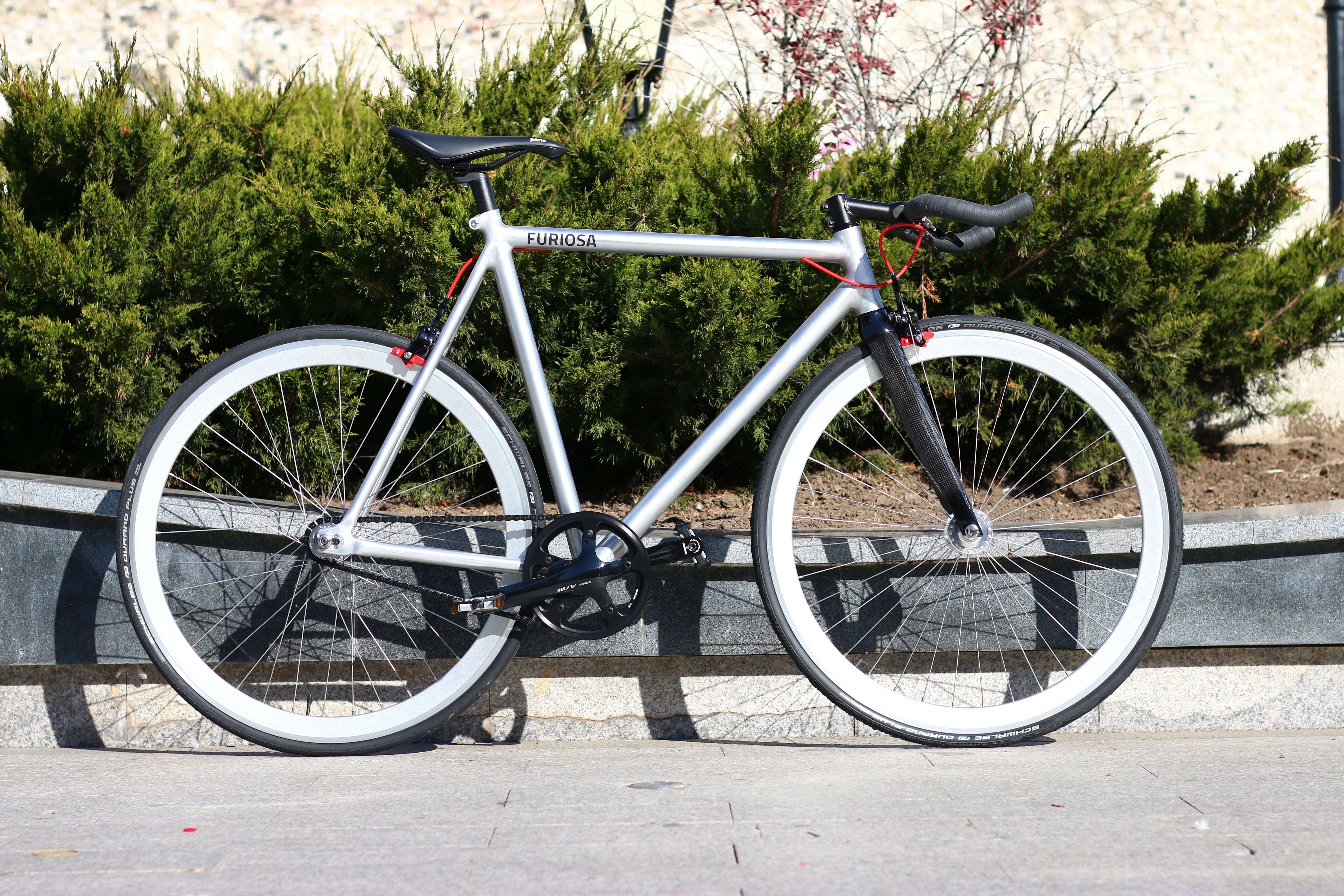 Silver Bicycle Parked Outdoors in Sunlight · Free Stock Photo