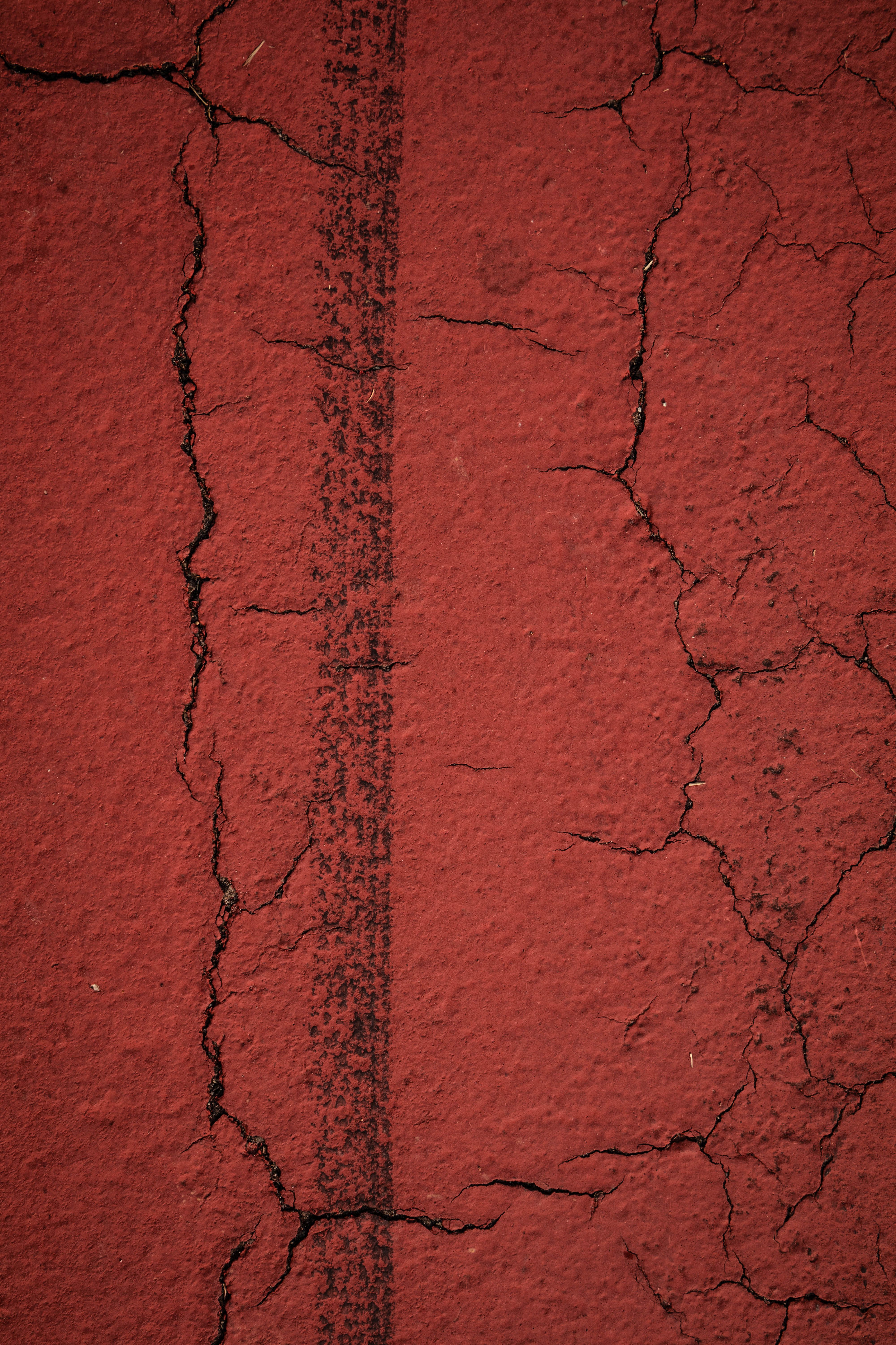 Close-up of Textured Red Cracked Wall Surface · Free Stock Photo