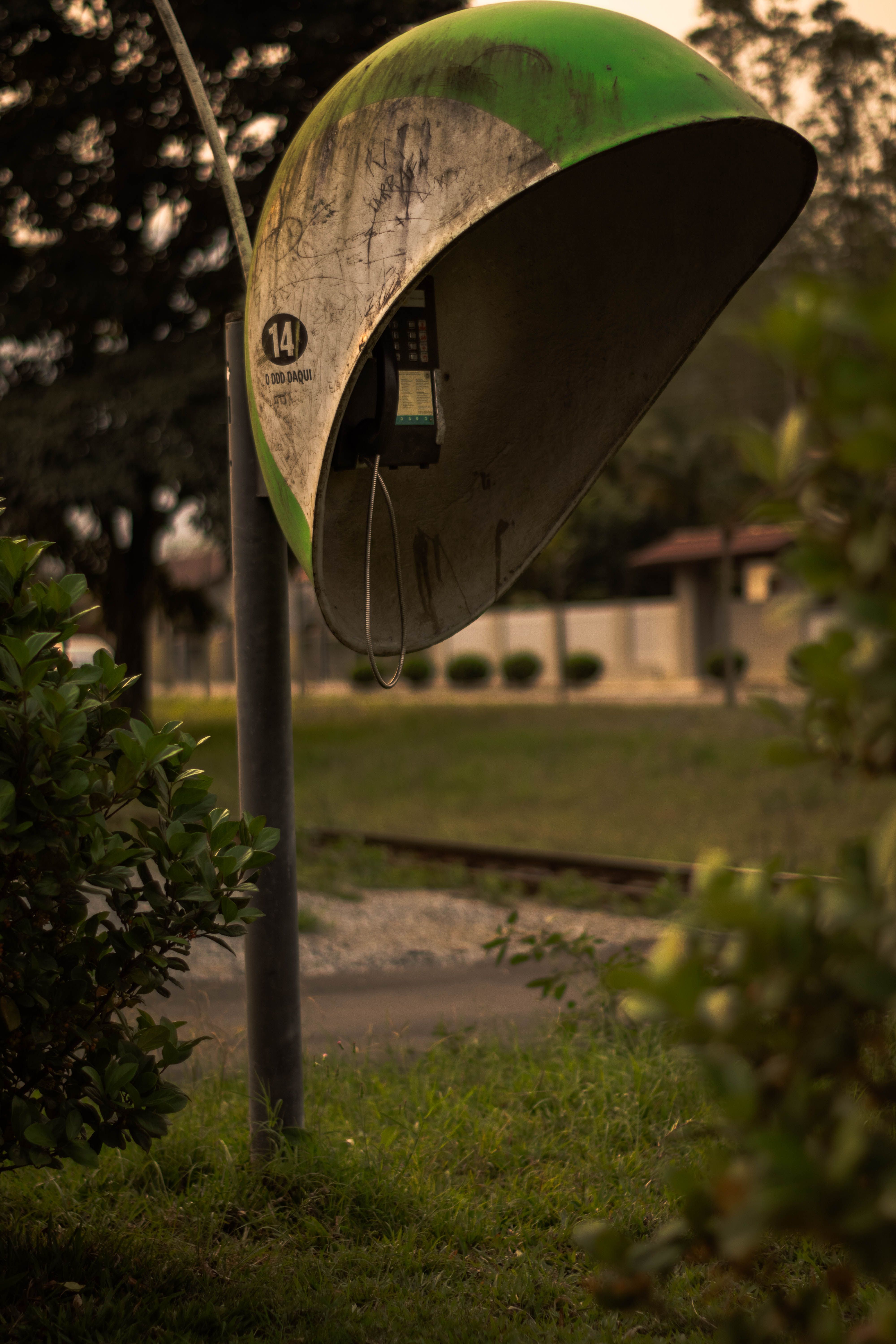 Vintage Outdoor Public Payphone at Sunset · Free Stock Photo