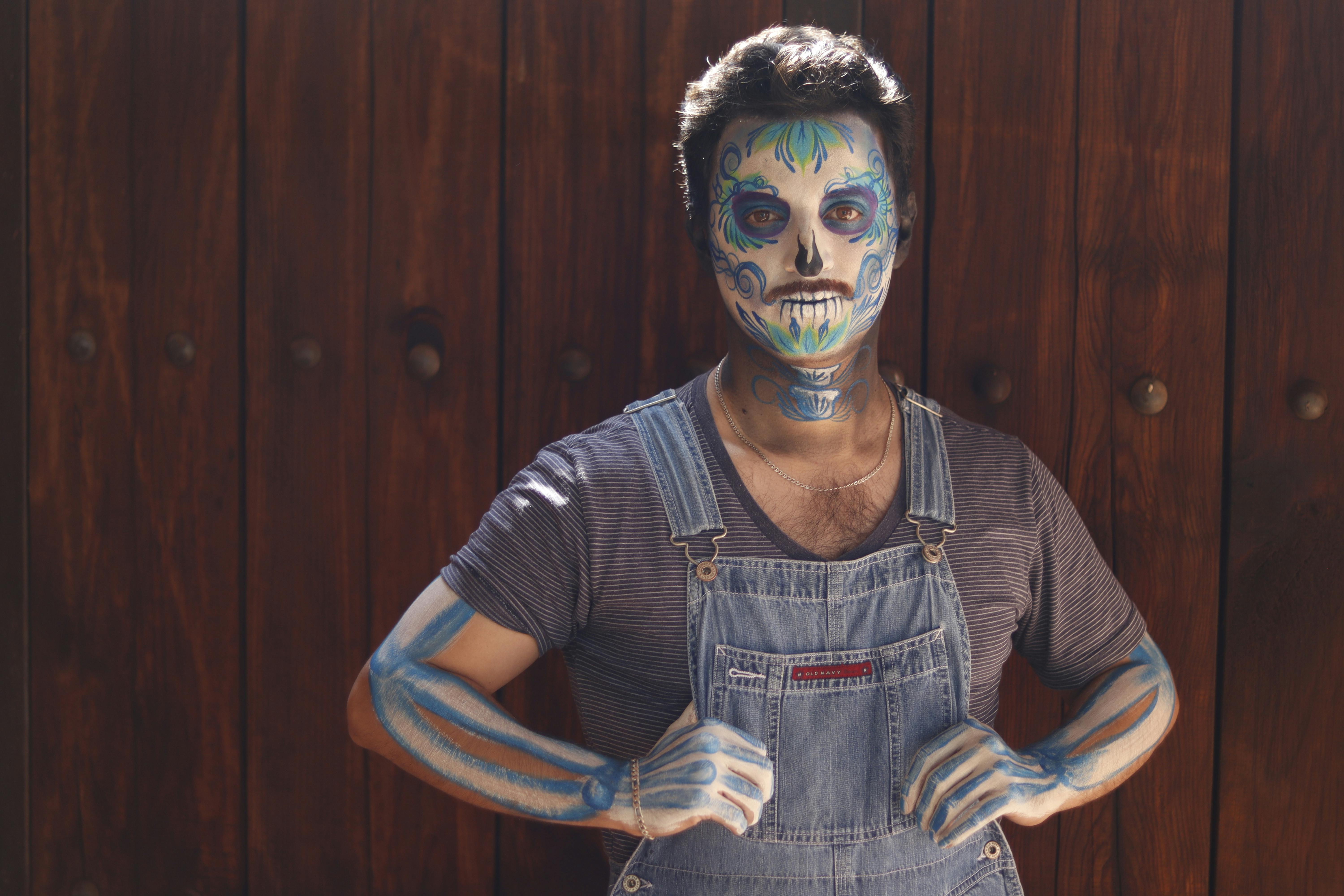 Man in Costume With Intricate Face Paint in Daylight · Free Stock Photo