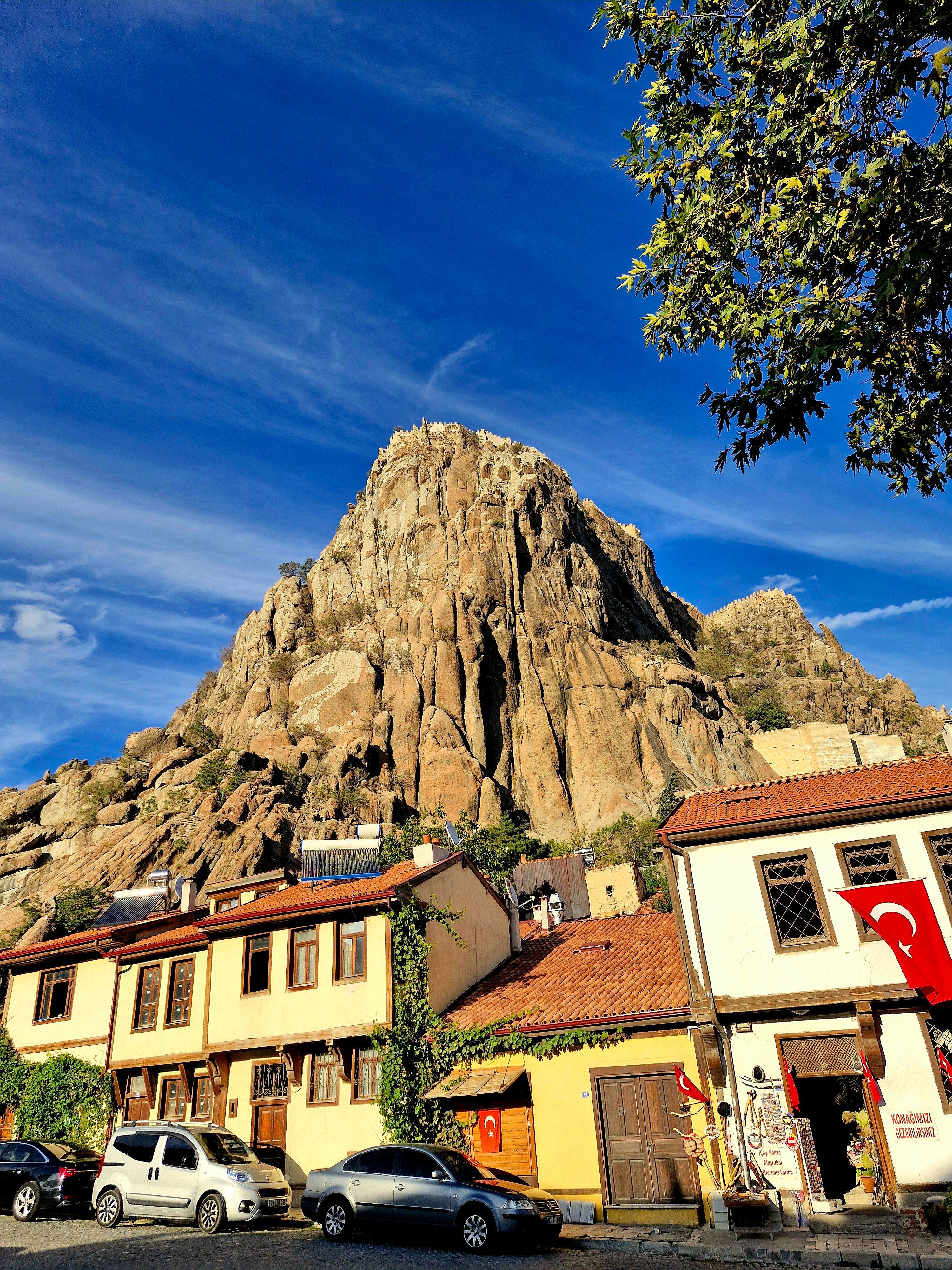 Ancient Rock Formation in Cultural Townscape · Free Stock Photo