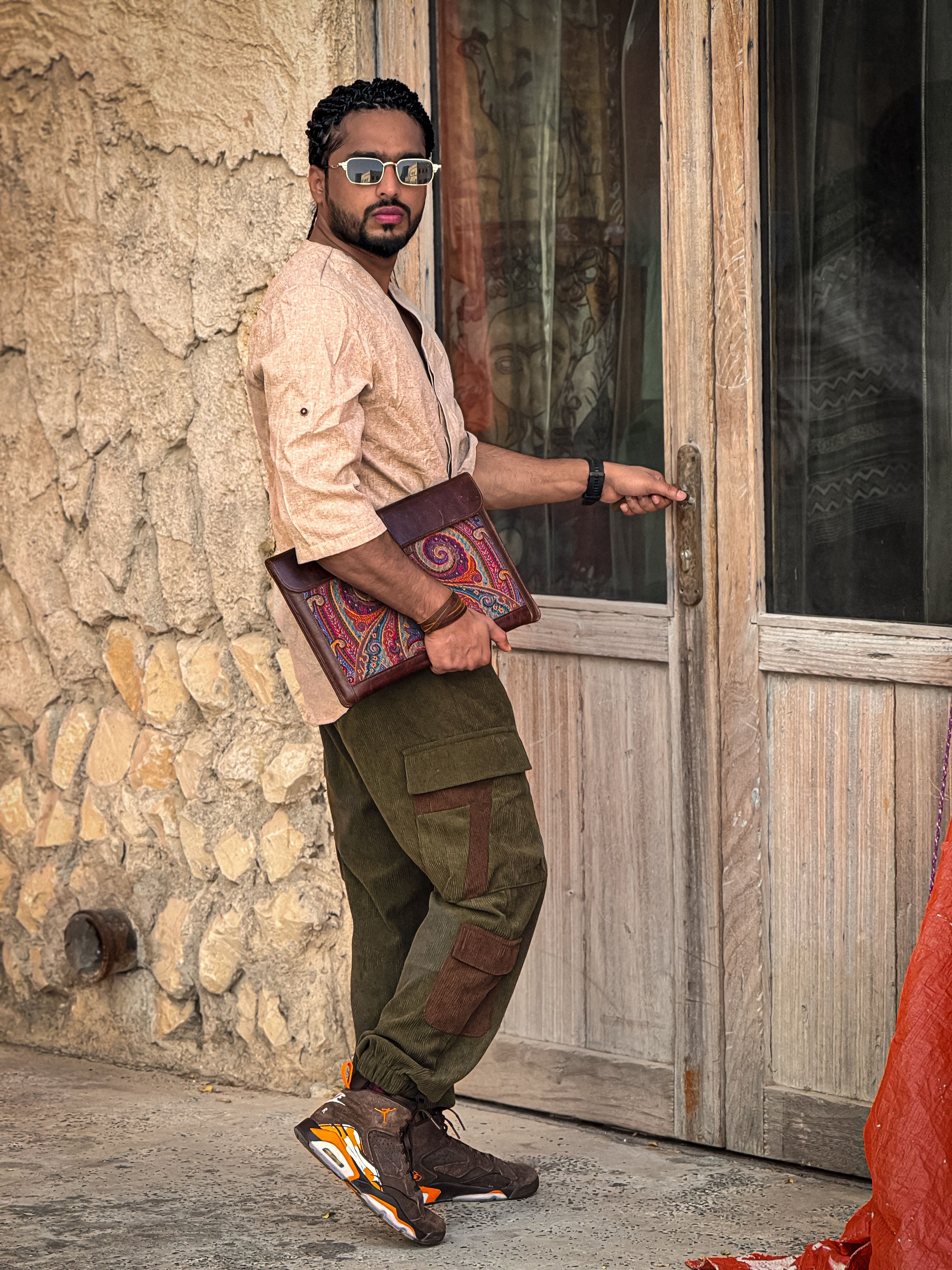 Stylish Man Posing in Traditional Dubai Setting · Free Stock Photo
