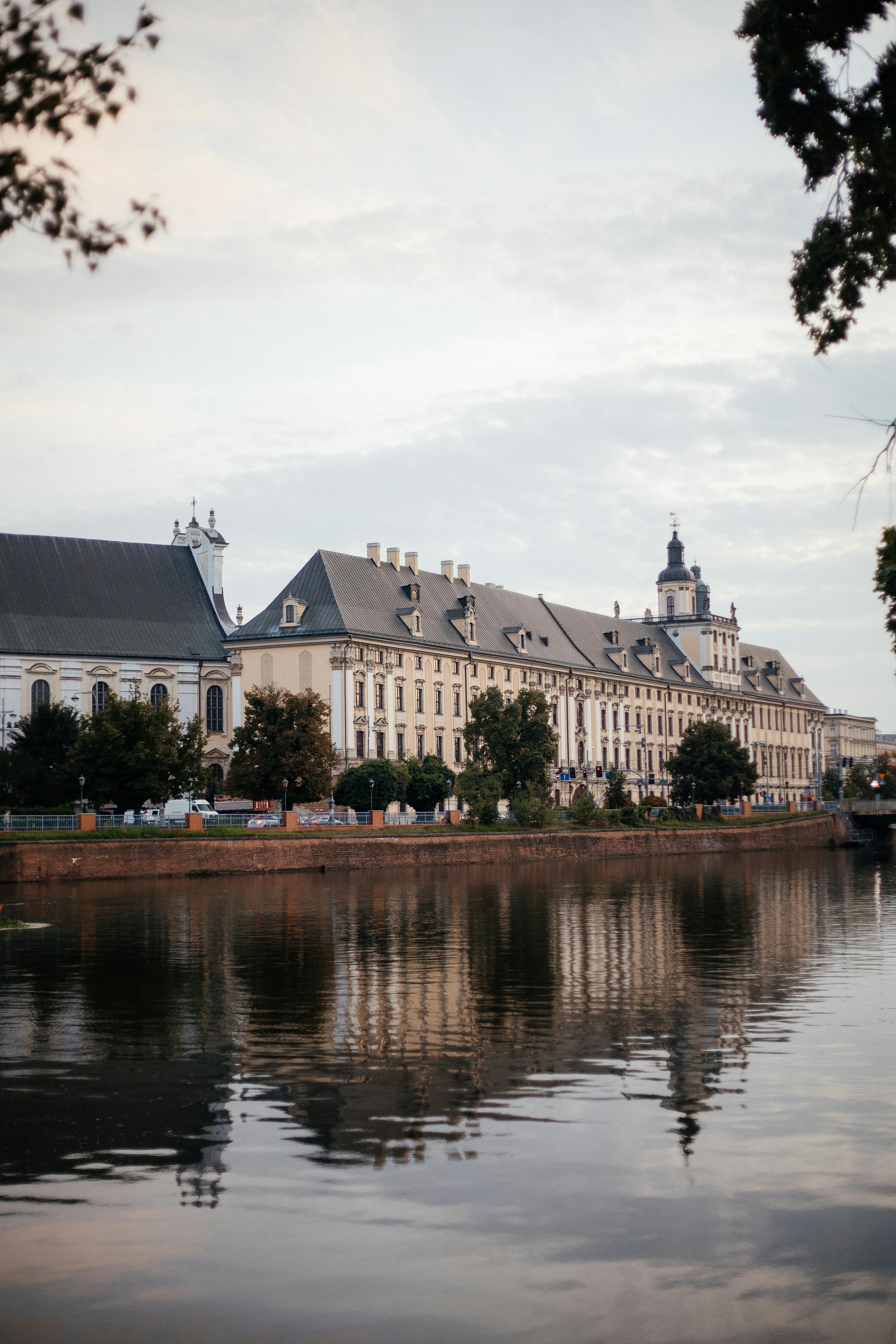 Stately Baroque Architecture by Serene River · Free Stock Photo