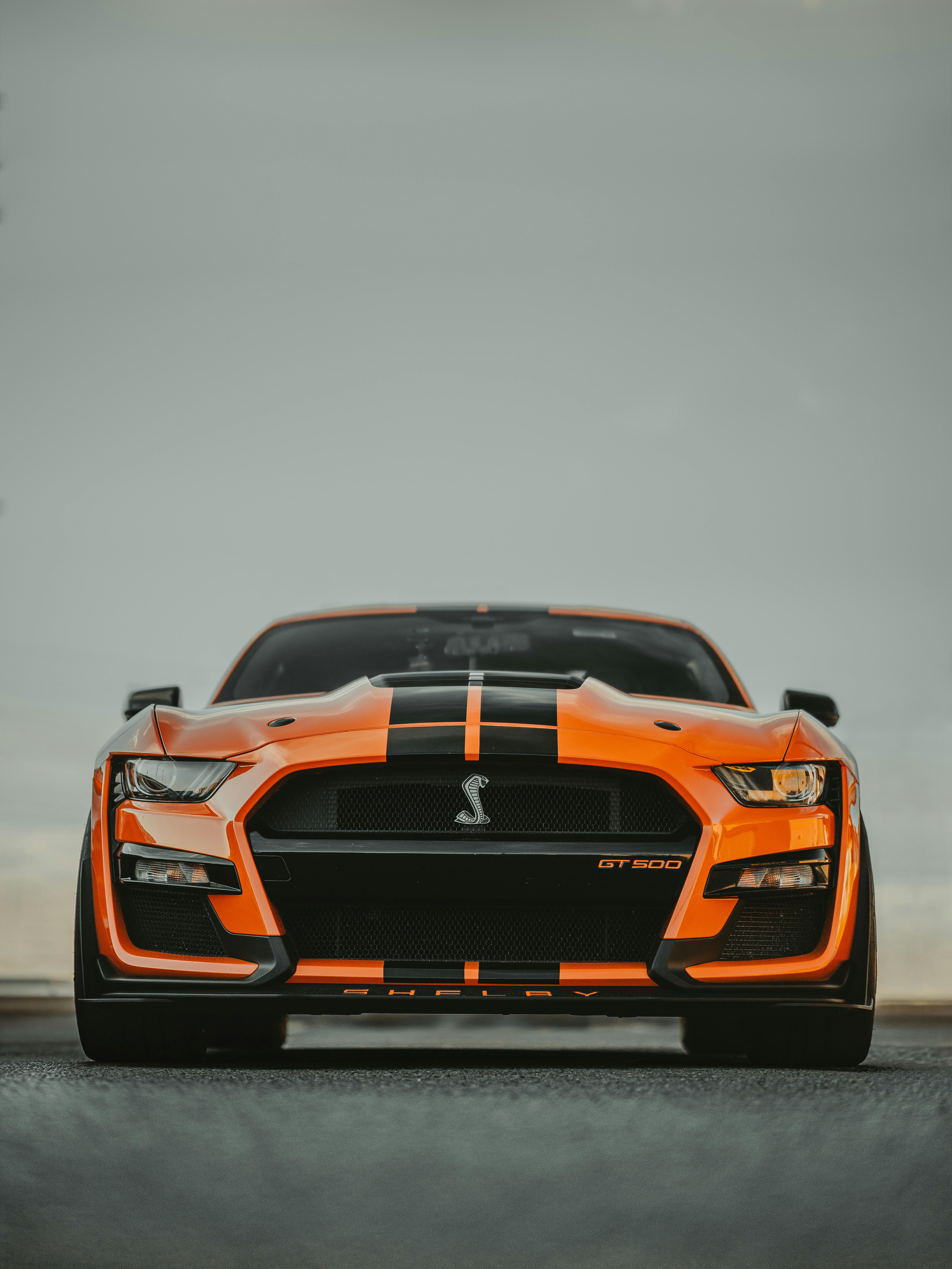Vibrant Orange Ford Mustang GT500 Front View · Free Stock Photo