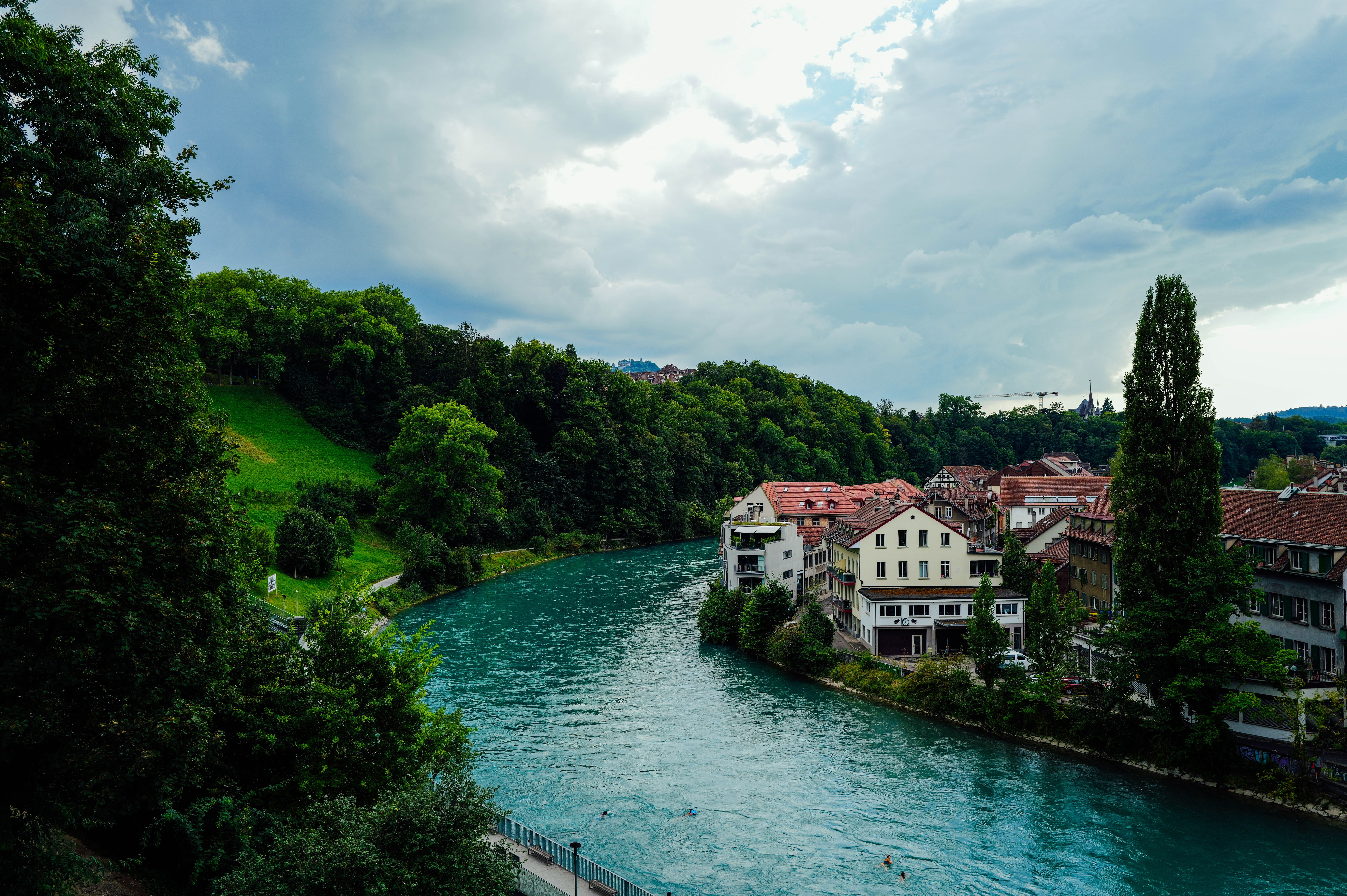 Scenic River and Town with Verdant Hillside · Free Stock Photo