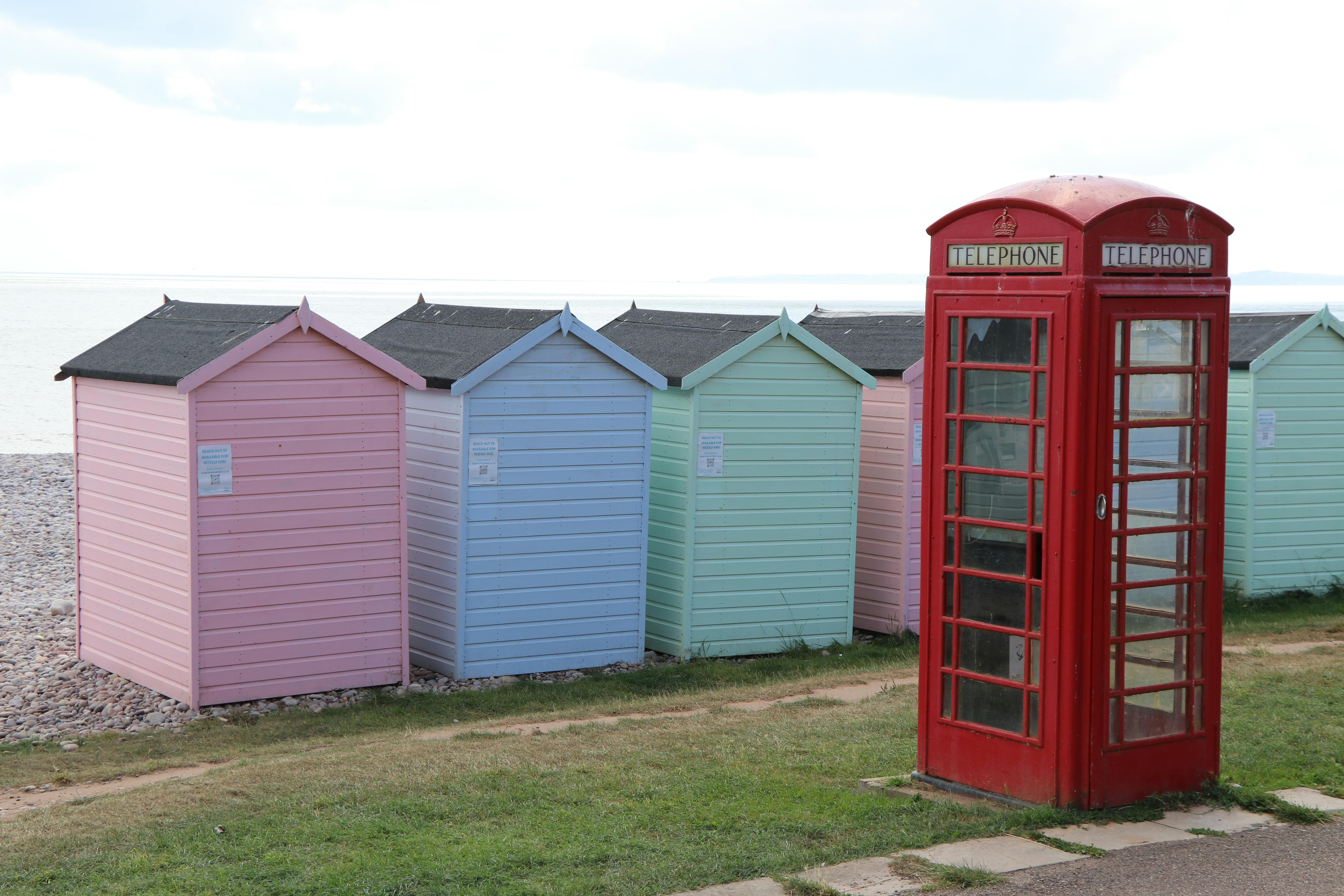 Colorful Beach Huts and English Phone Booth in Budleigh Salterton ...