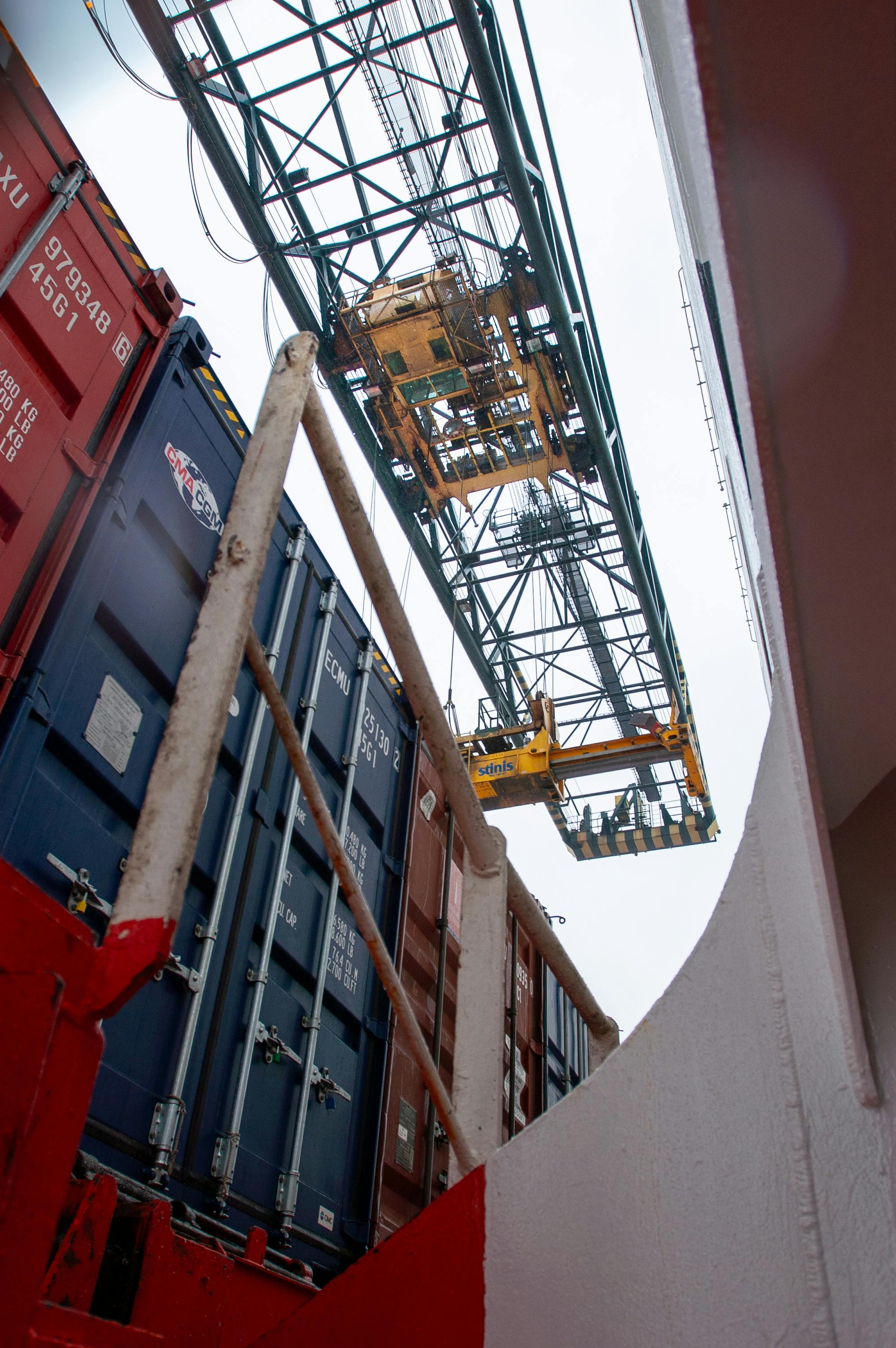 View from Below: Container Loading Crane Overhead · Free Stock Photo