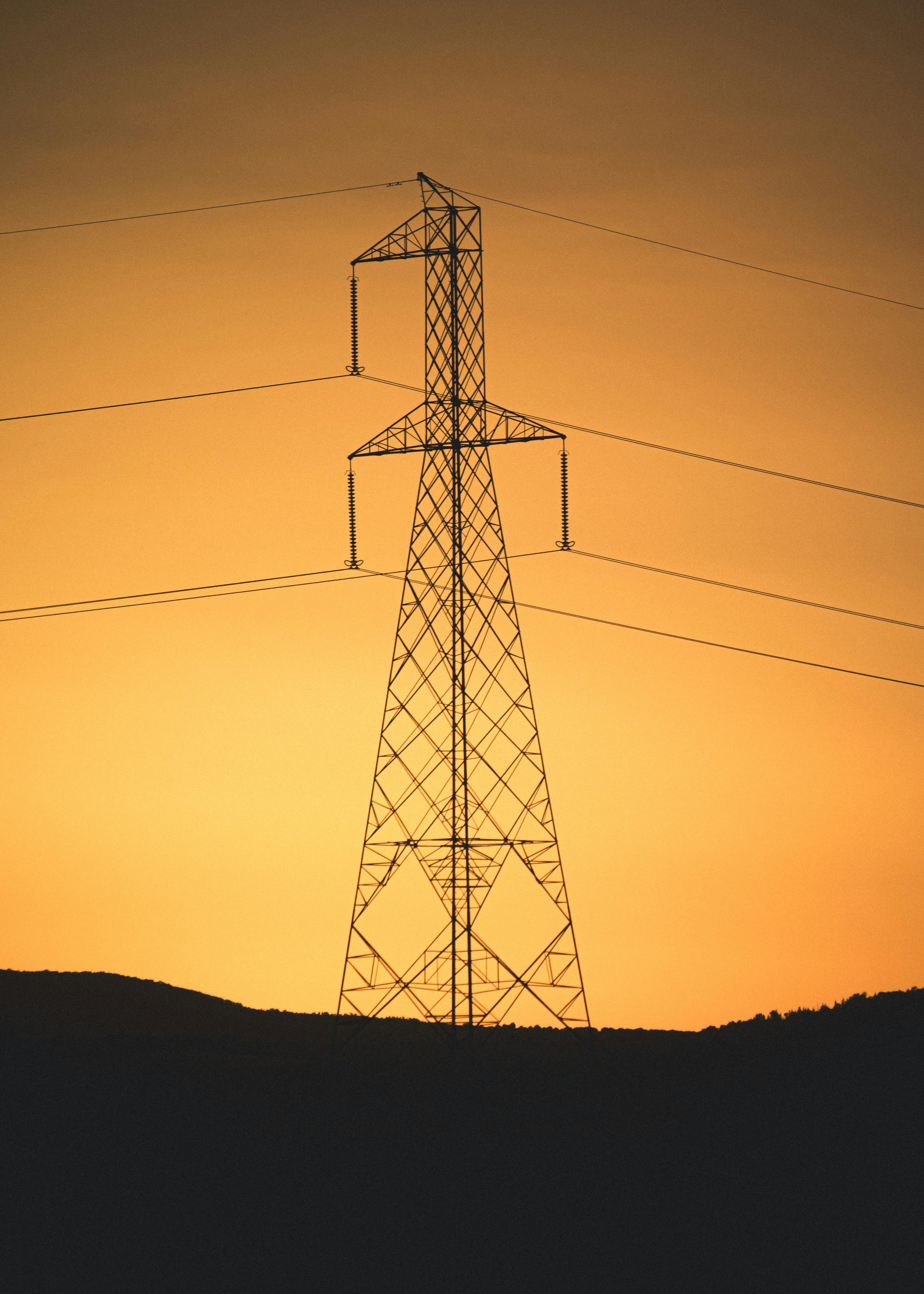 Electric Tower Under Cloudy Sky · Free Stock Photo