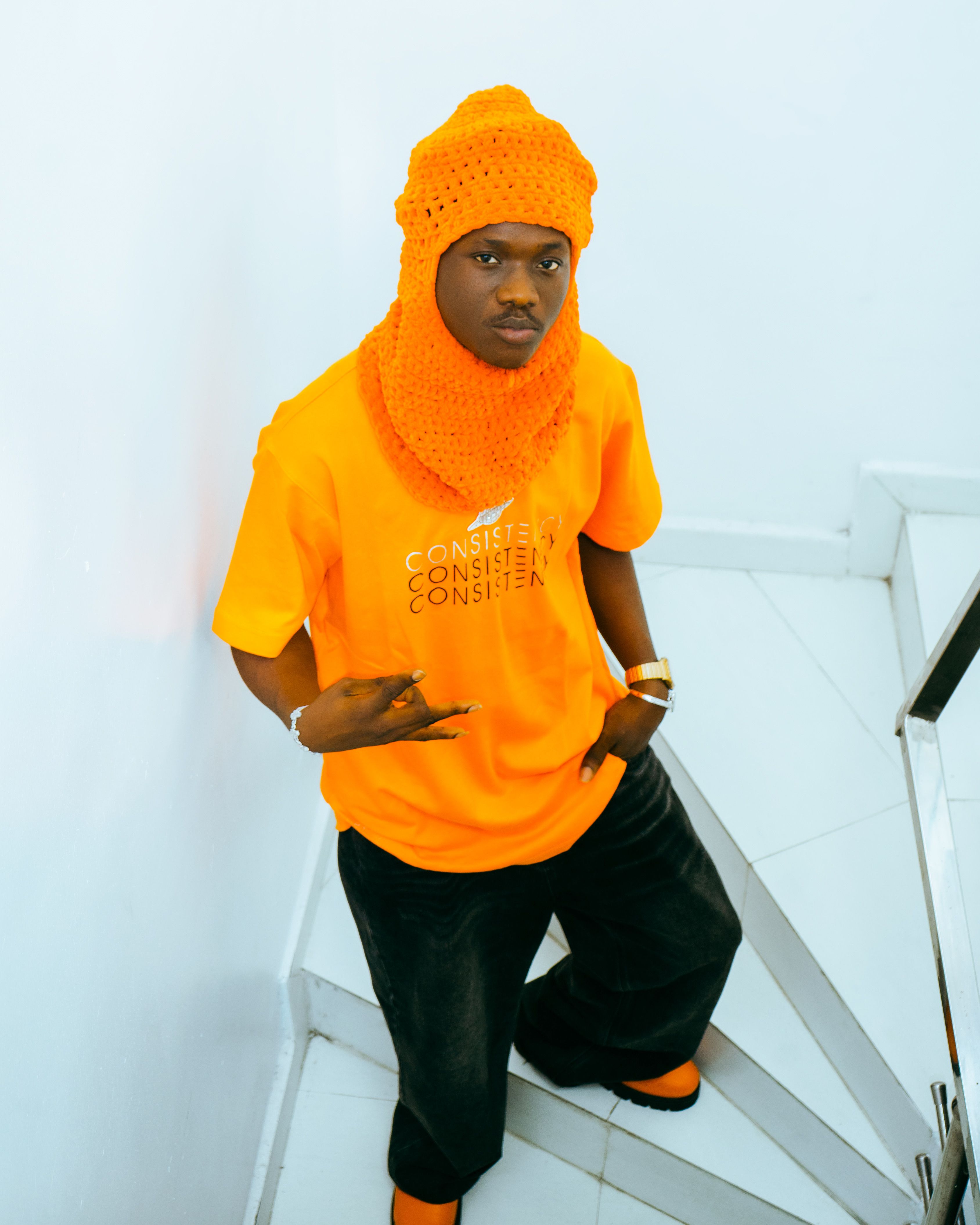 Fashionable young man in orange attire · Free Stock Photo