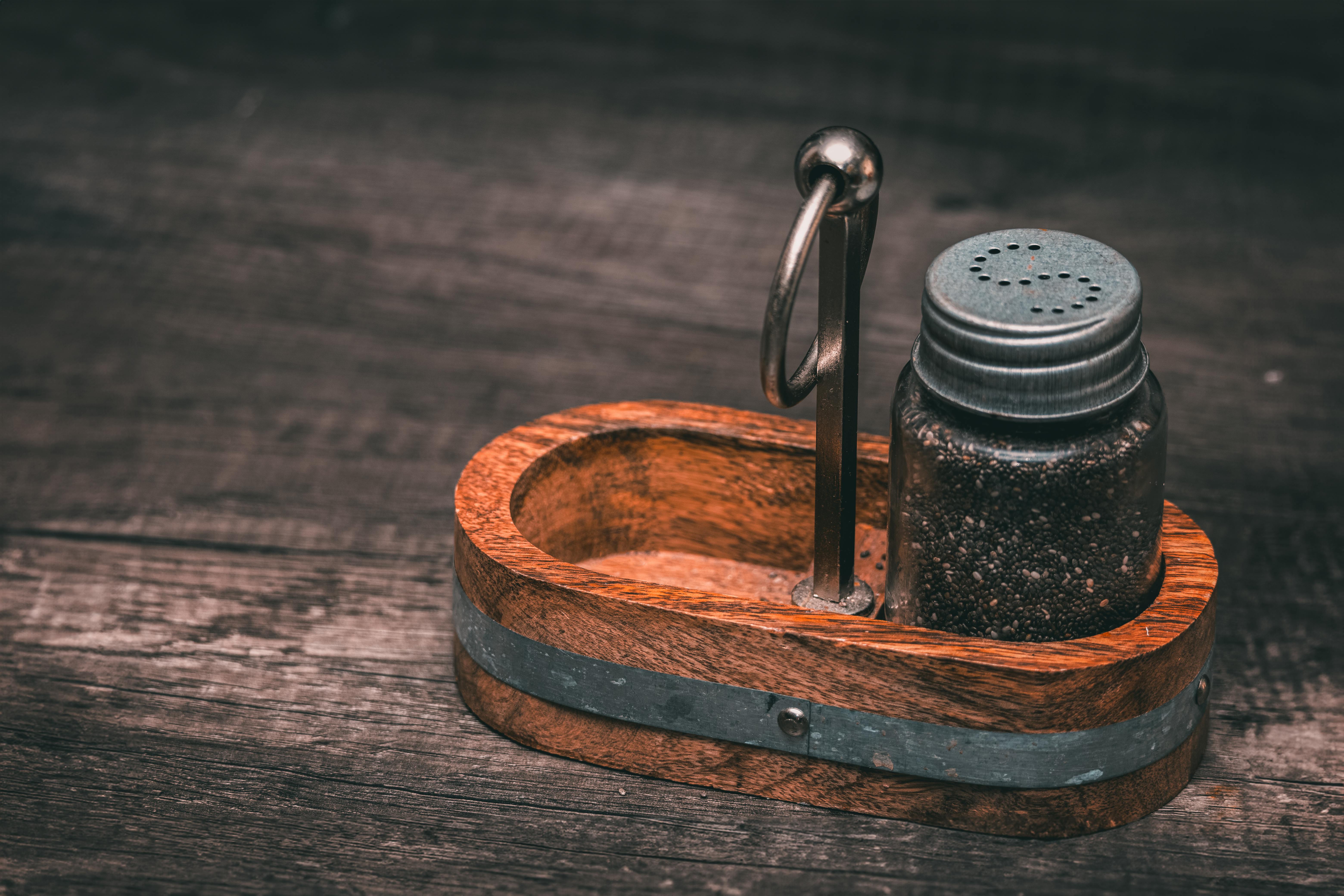 Rustic Chia Seed Dispenser on Wooden Table · Free Stock Photo