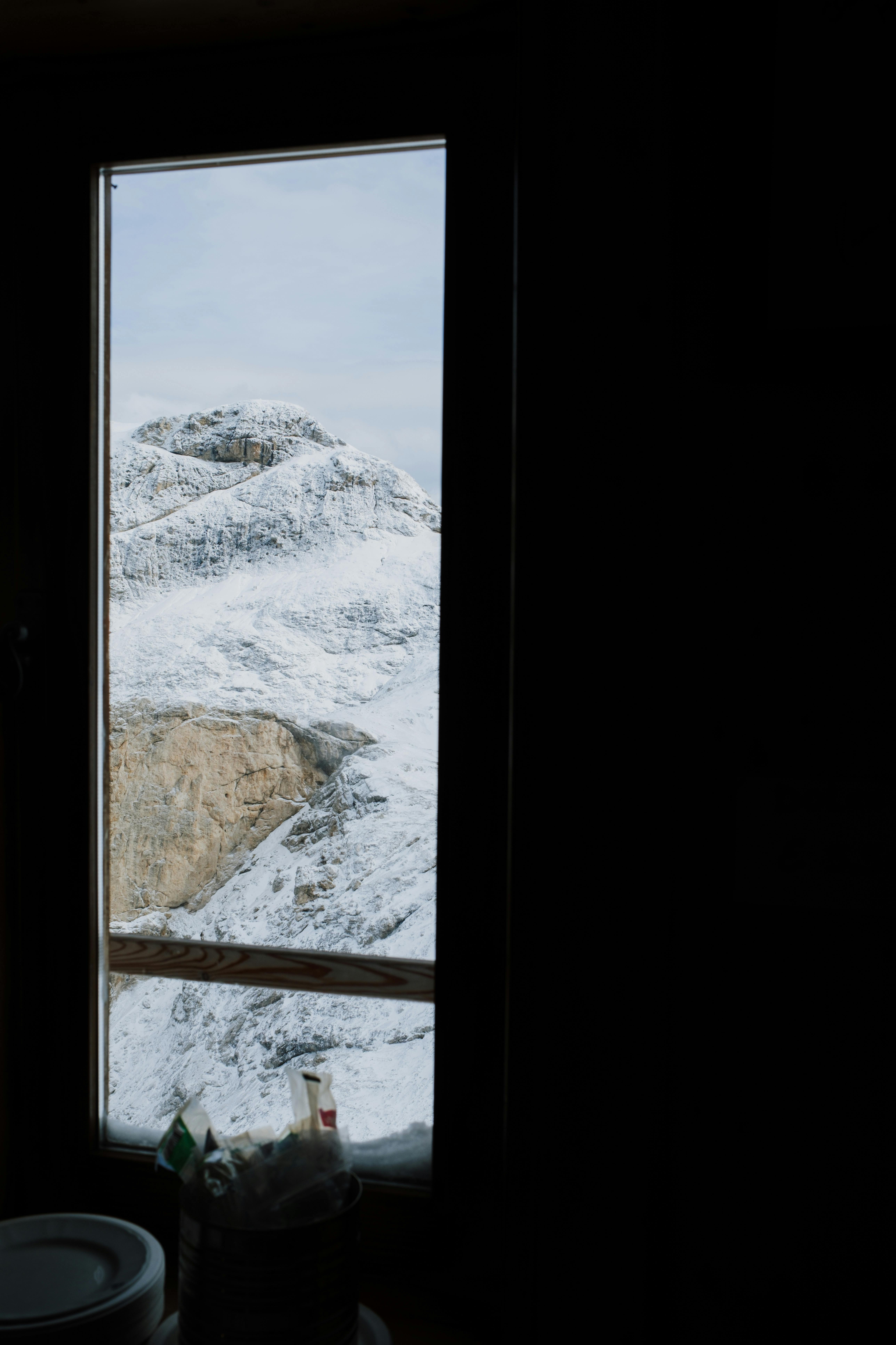 Snowy Mountain View from Cabin Window · Free Stock Photo