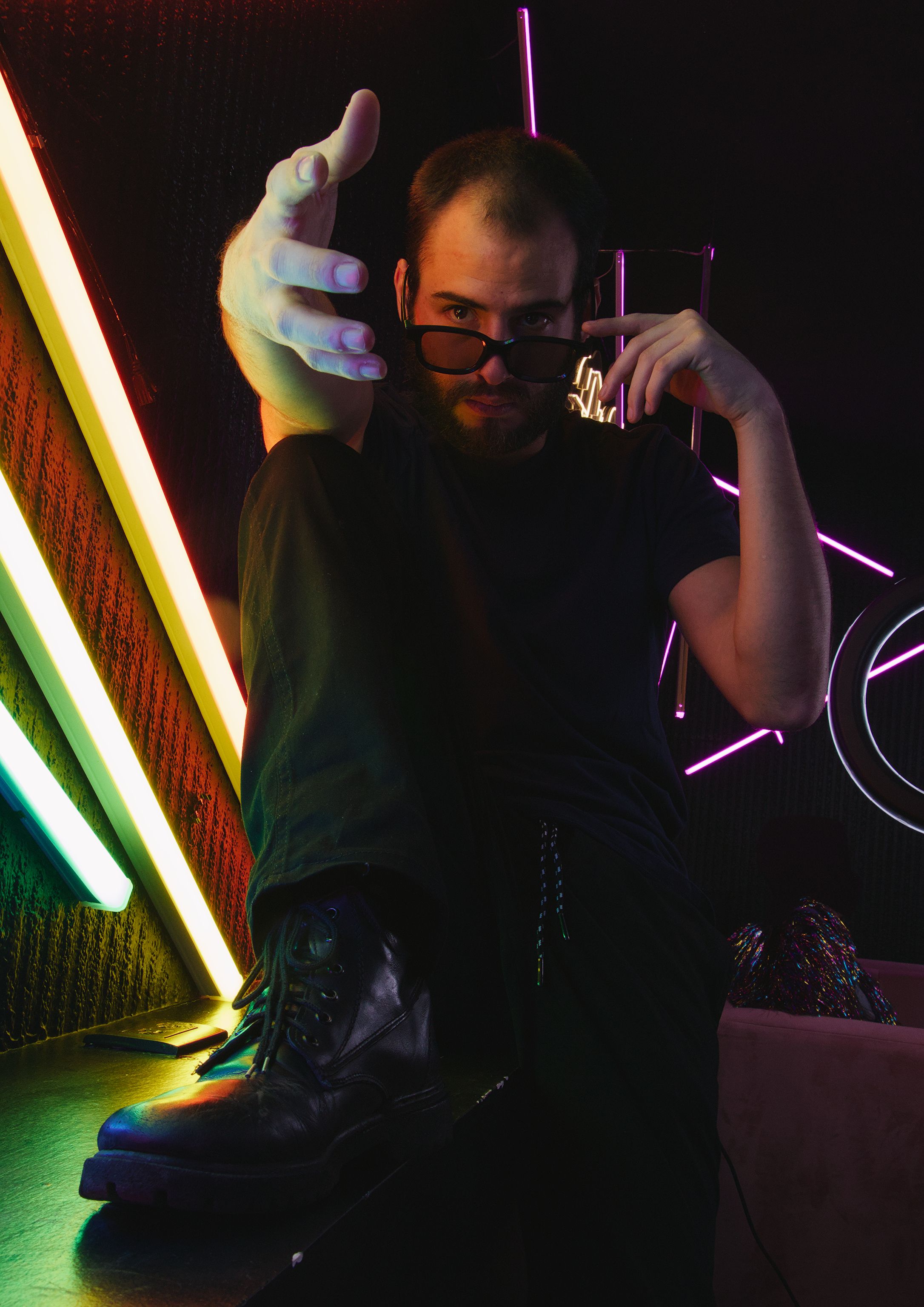 Stylish Man in Neon Lit Modern Setting · Free Stock Photo