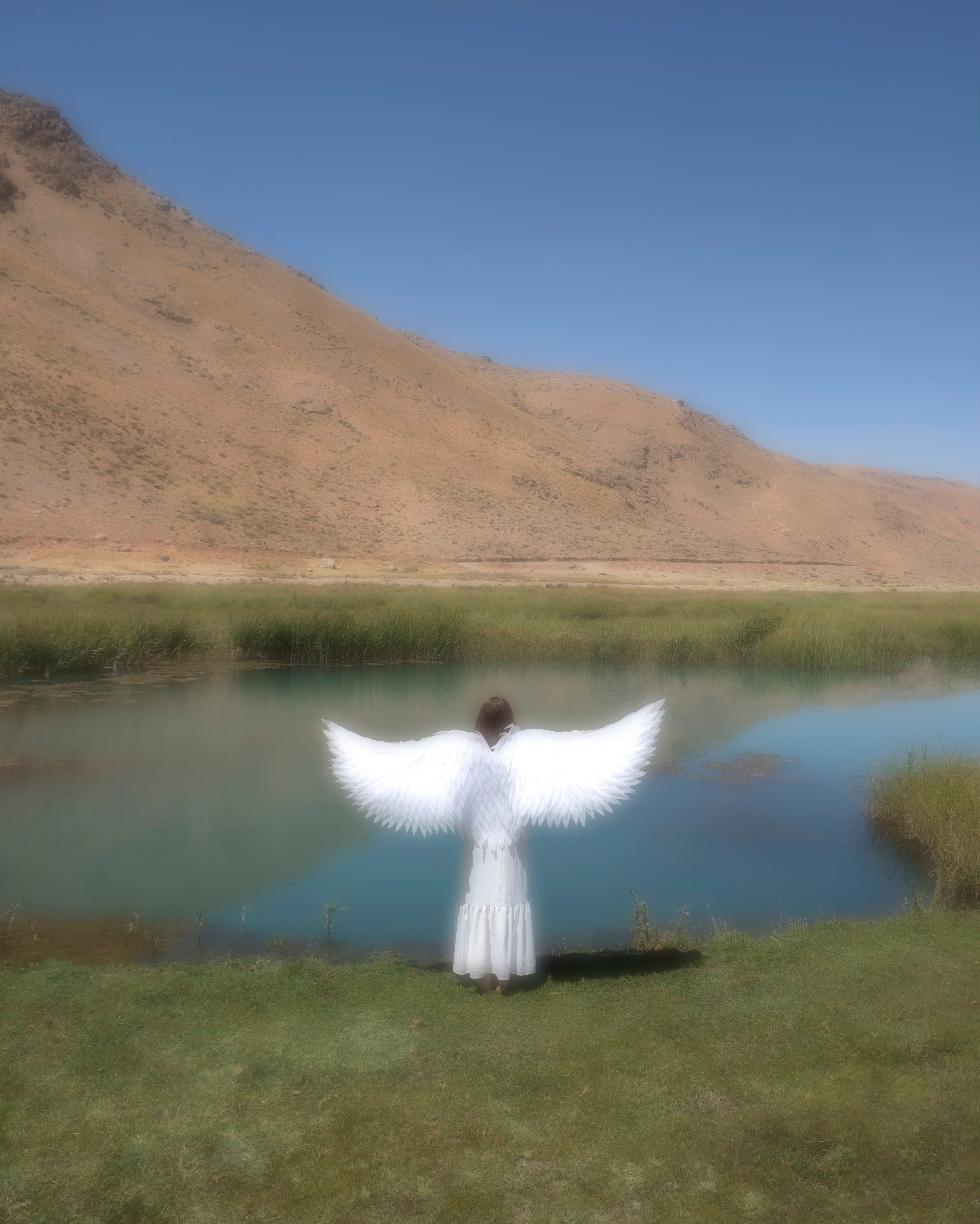 Angel Figure by Mountain Lake in Serene Landscape · Free Stock Photo
