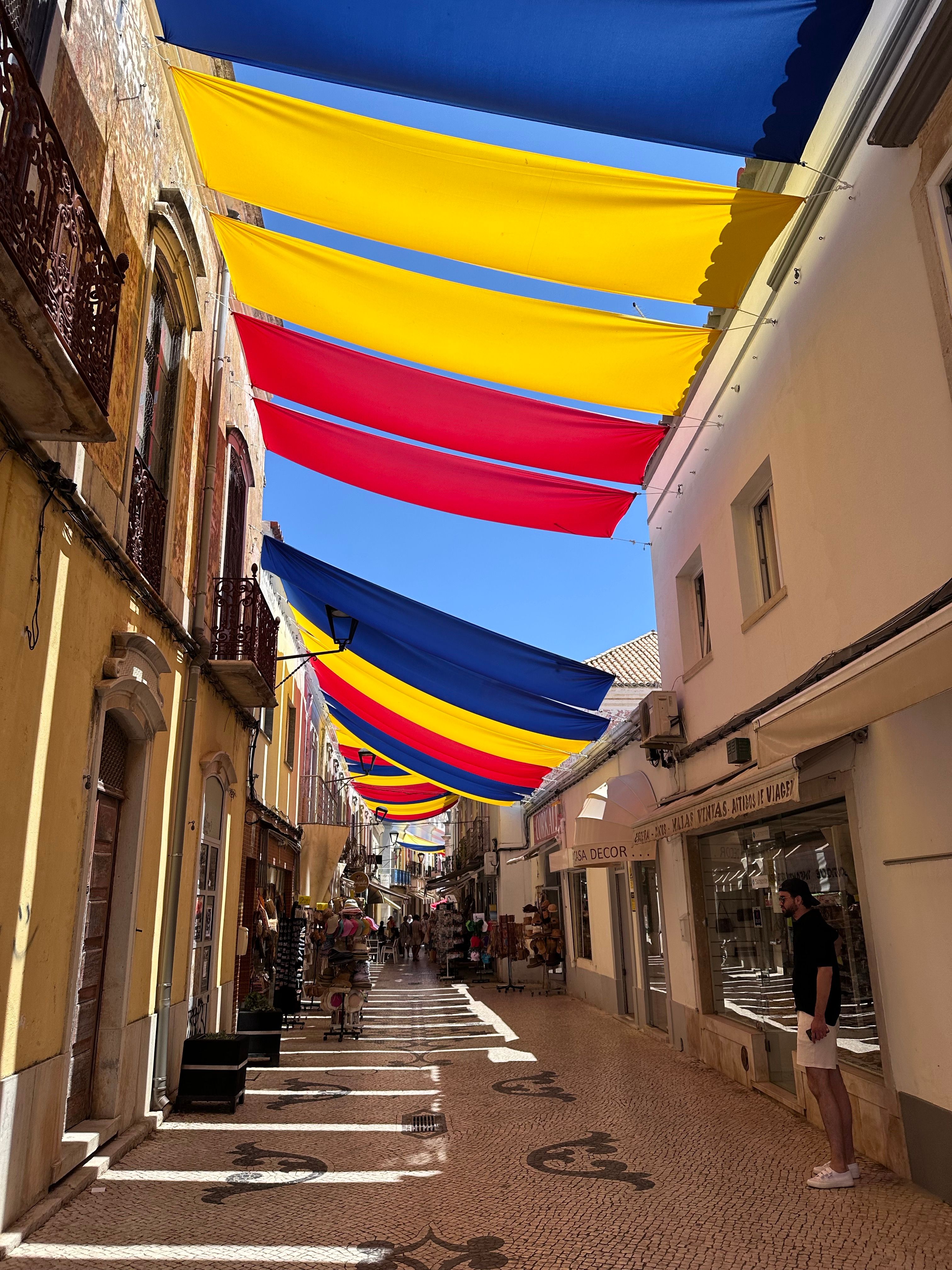 Colorful Canopies on a Sunny Street in Portugal · Free Stock Photo