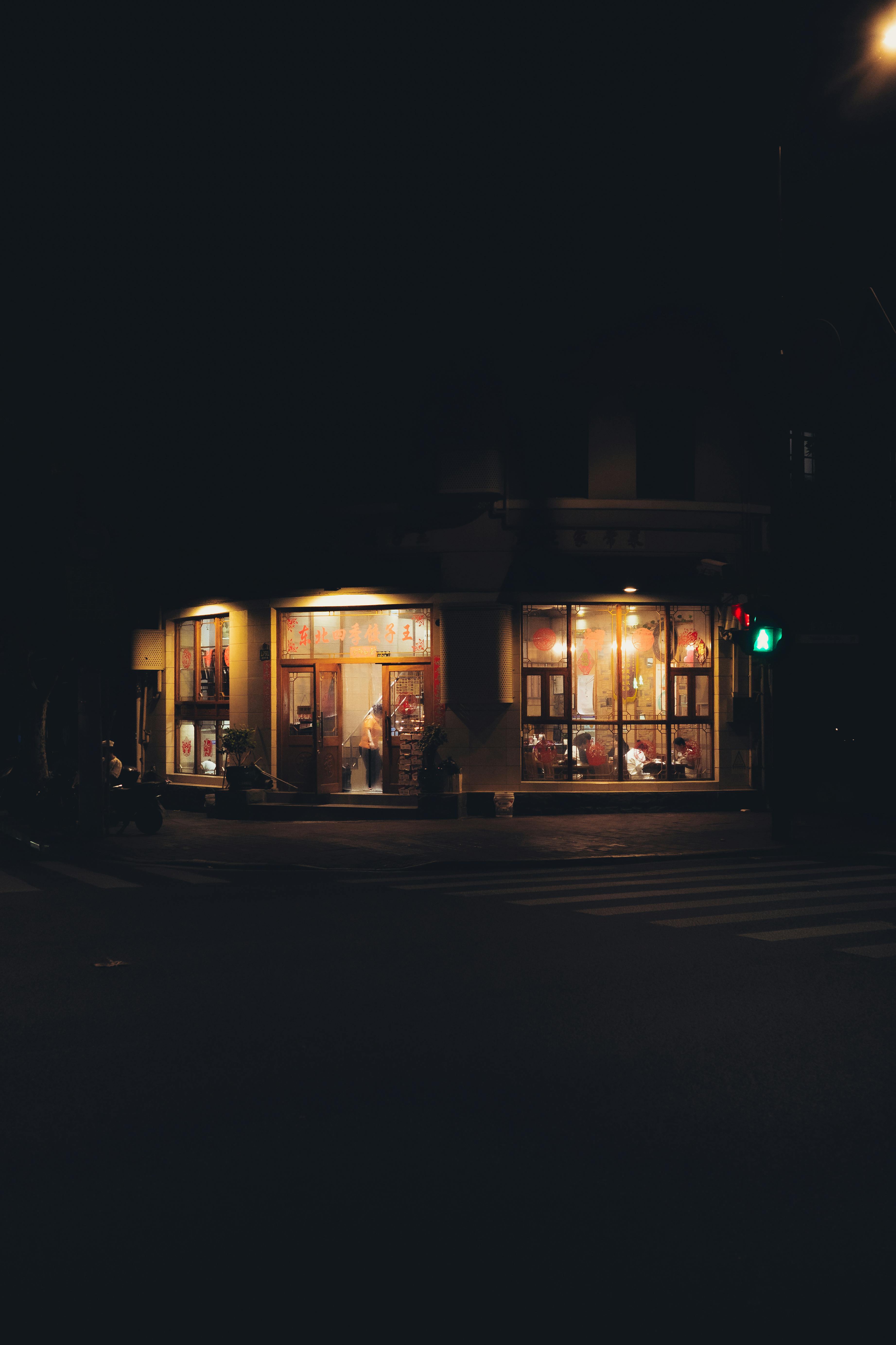 Cozy Cafe at Night with Warm Lighting Ambiance · Free Stock Photo
