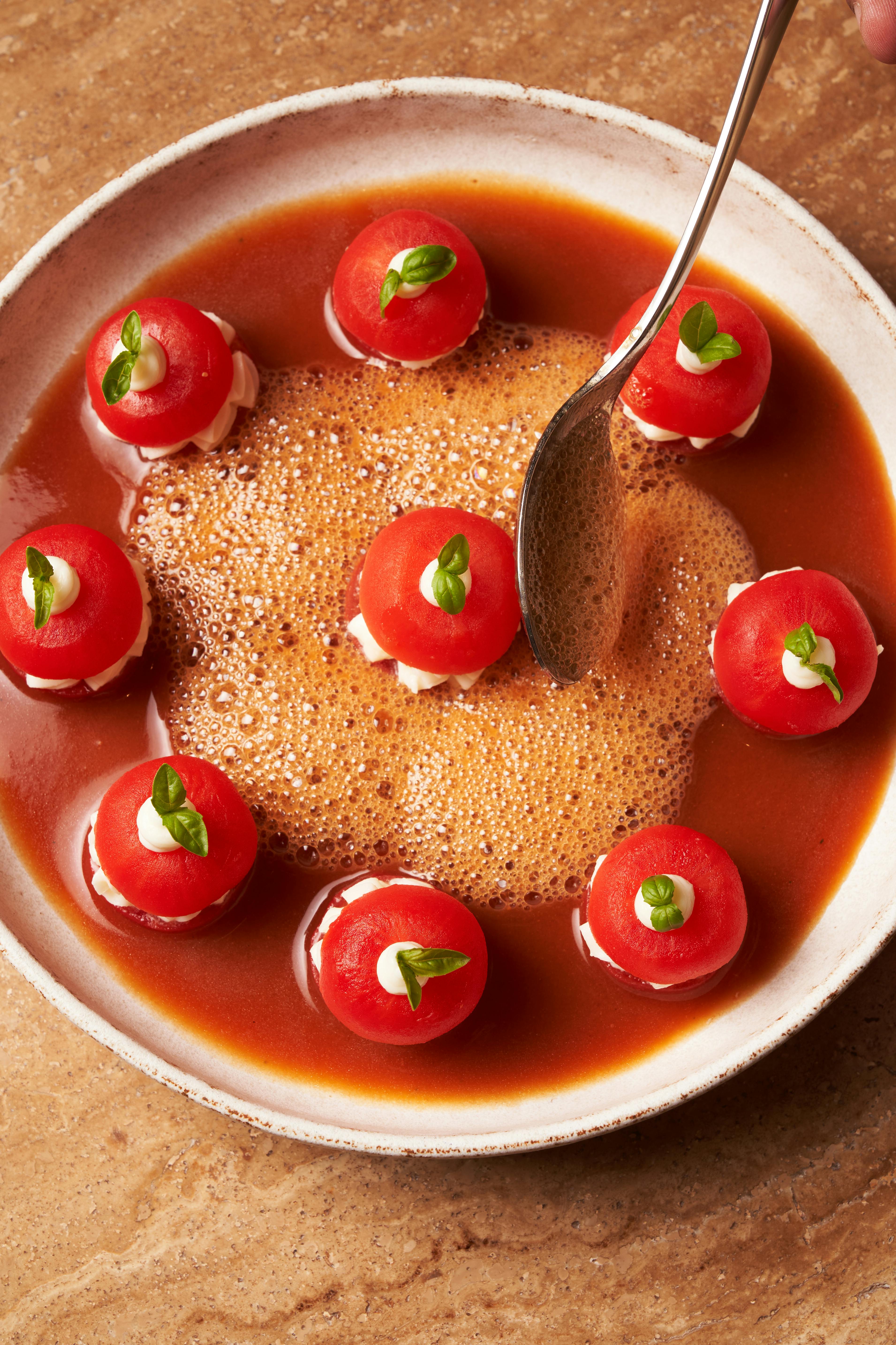 Elegant Tomato Consommé with Basil Garnish · Free Stock Photo
