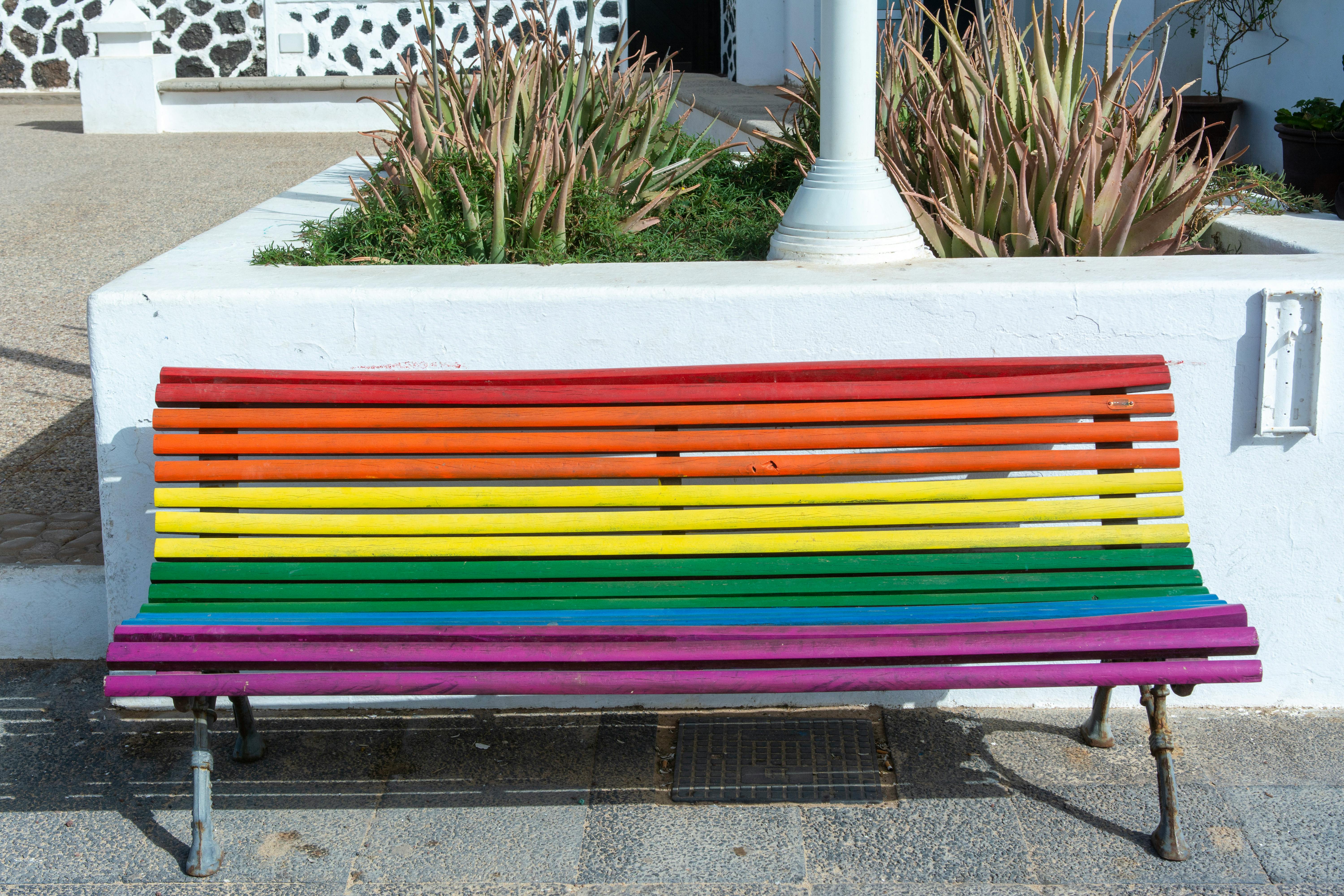 Colorful Rainbow Bench in Outdoor Urban Setting · Free Stock Photo