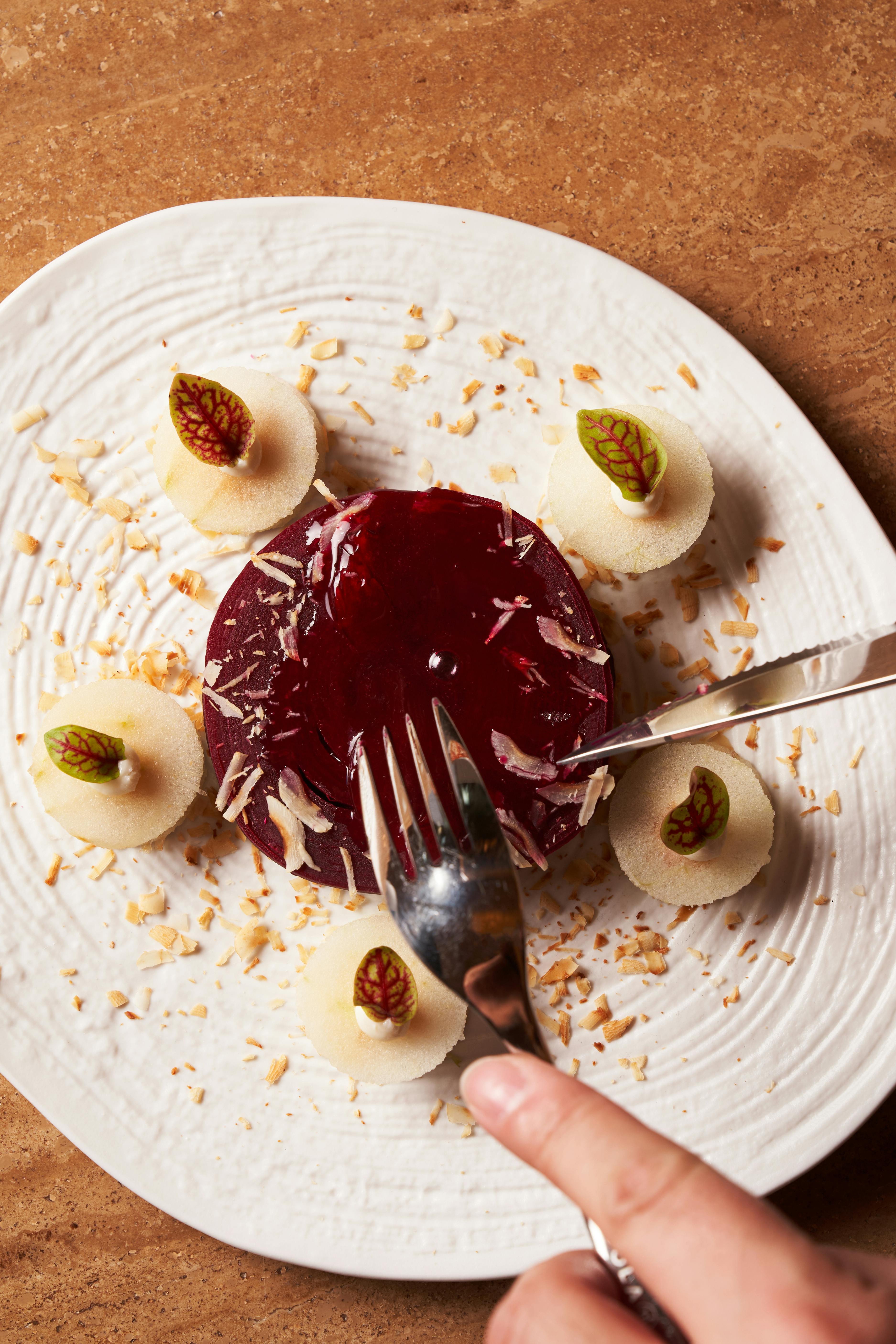 Gourmet Dessert with Red Berry Gelée and Coconut Flakes · Free Stock Photo
