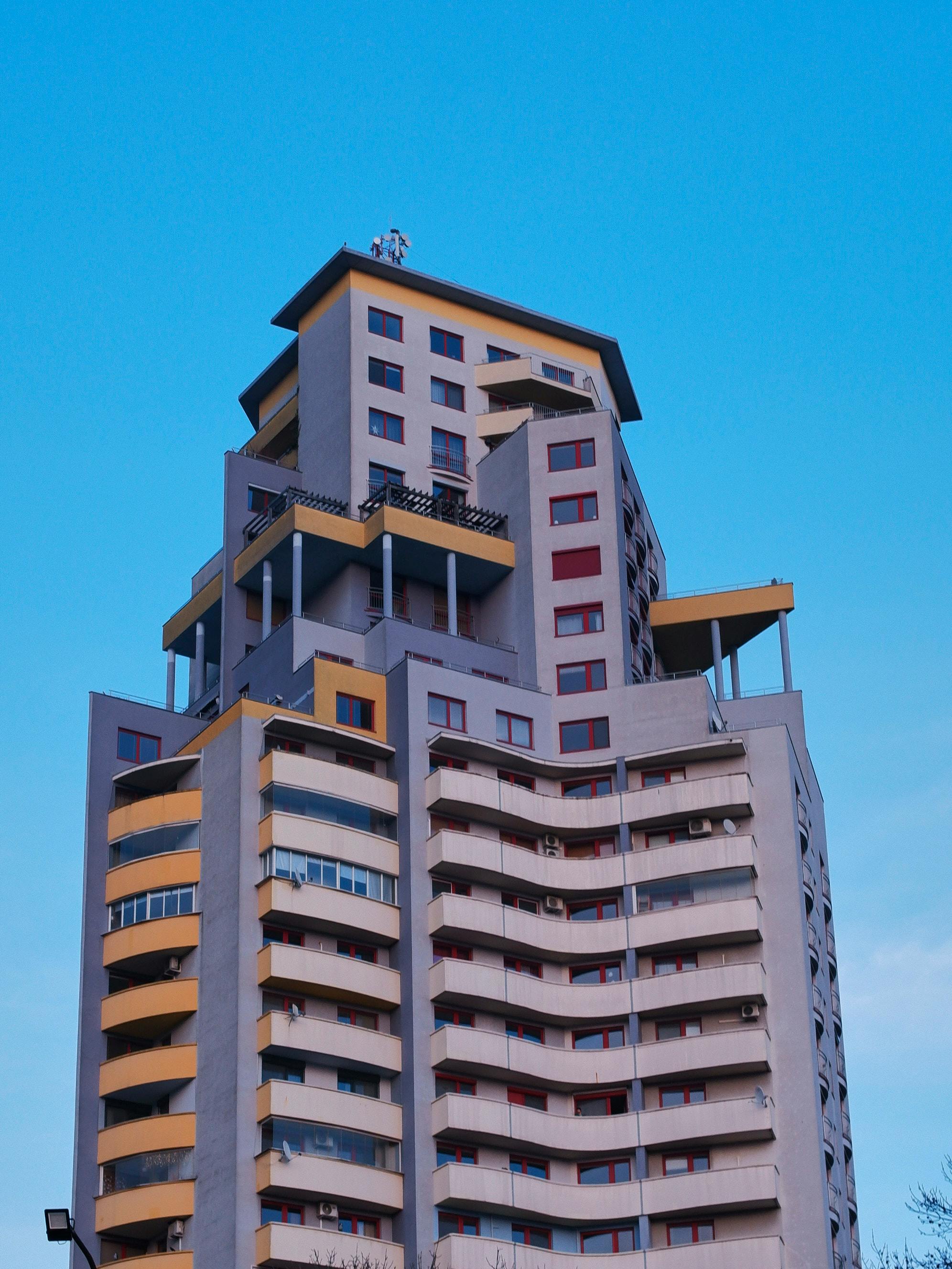 Modern Multi-Story Building Against Clear Sky · Free Stock Photo