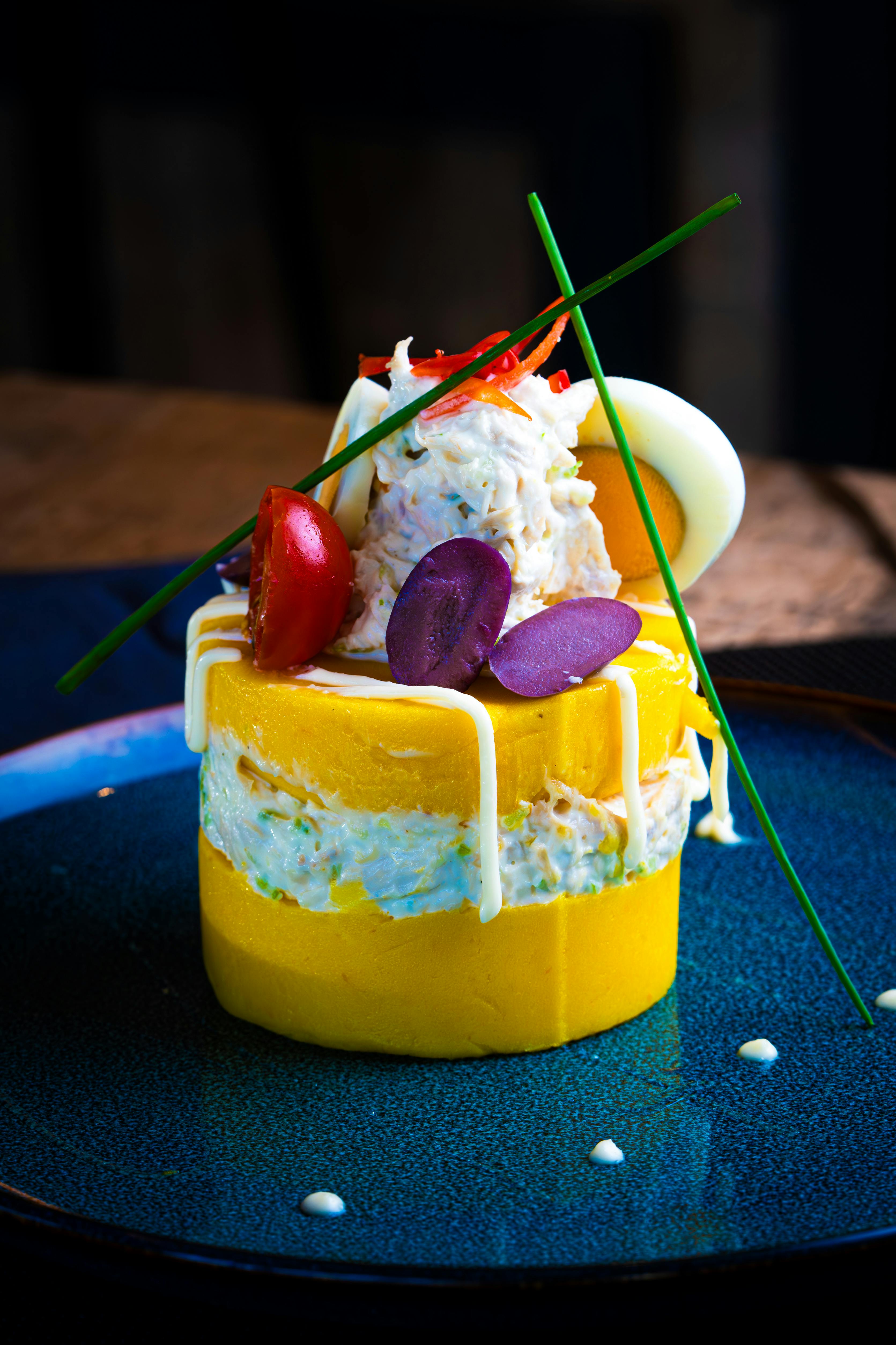 Elegant Peruvian Food Dish with Vibrant Garnish · Free Stock Photo