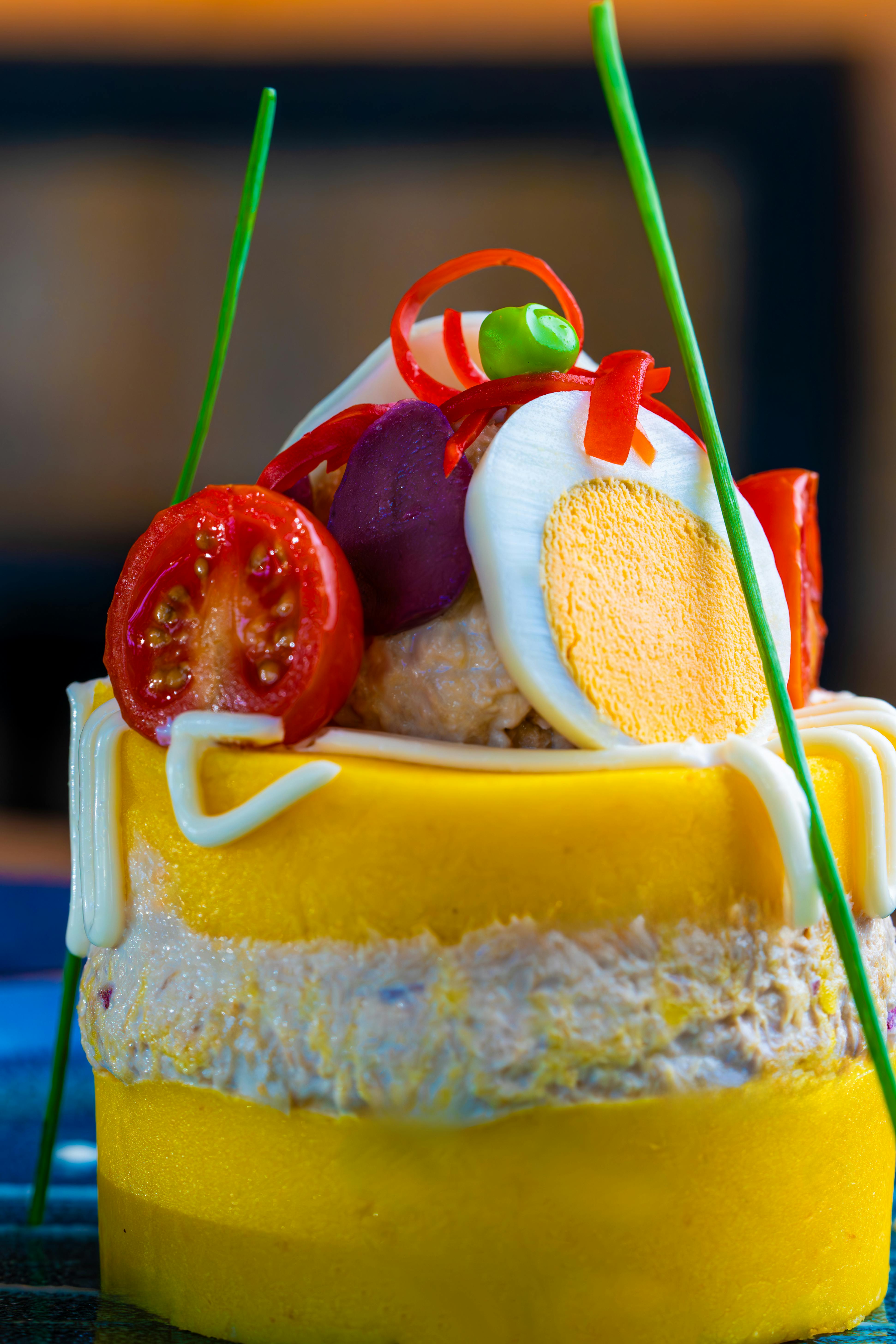 Colorful Peruvian Causa Rellena Dish Close-up · Free Stock Photo