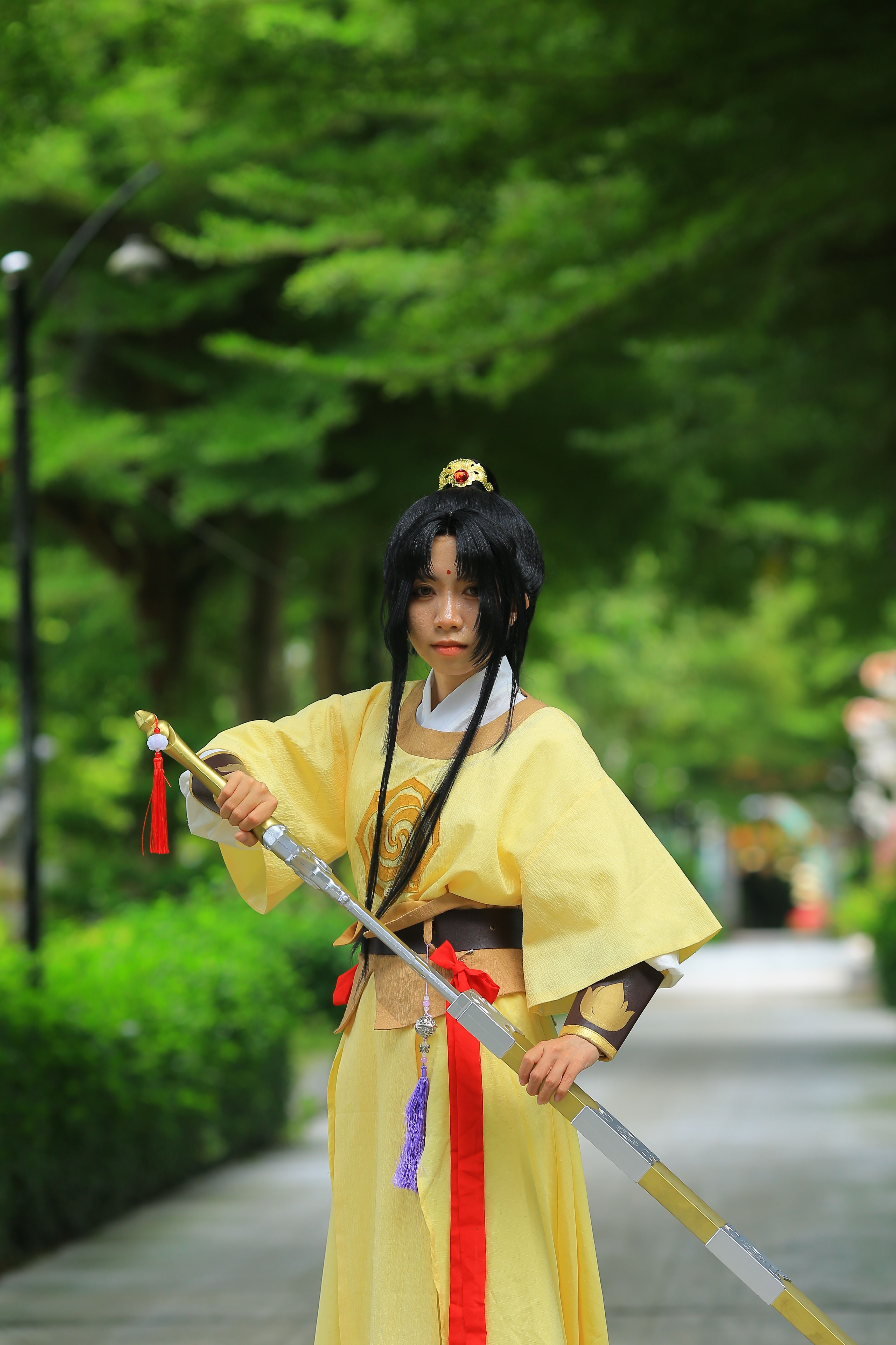 Cosplay Character in Traditional Yellow Robe Outdoors · Free Stock Photo