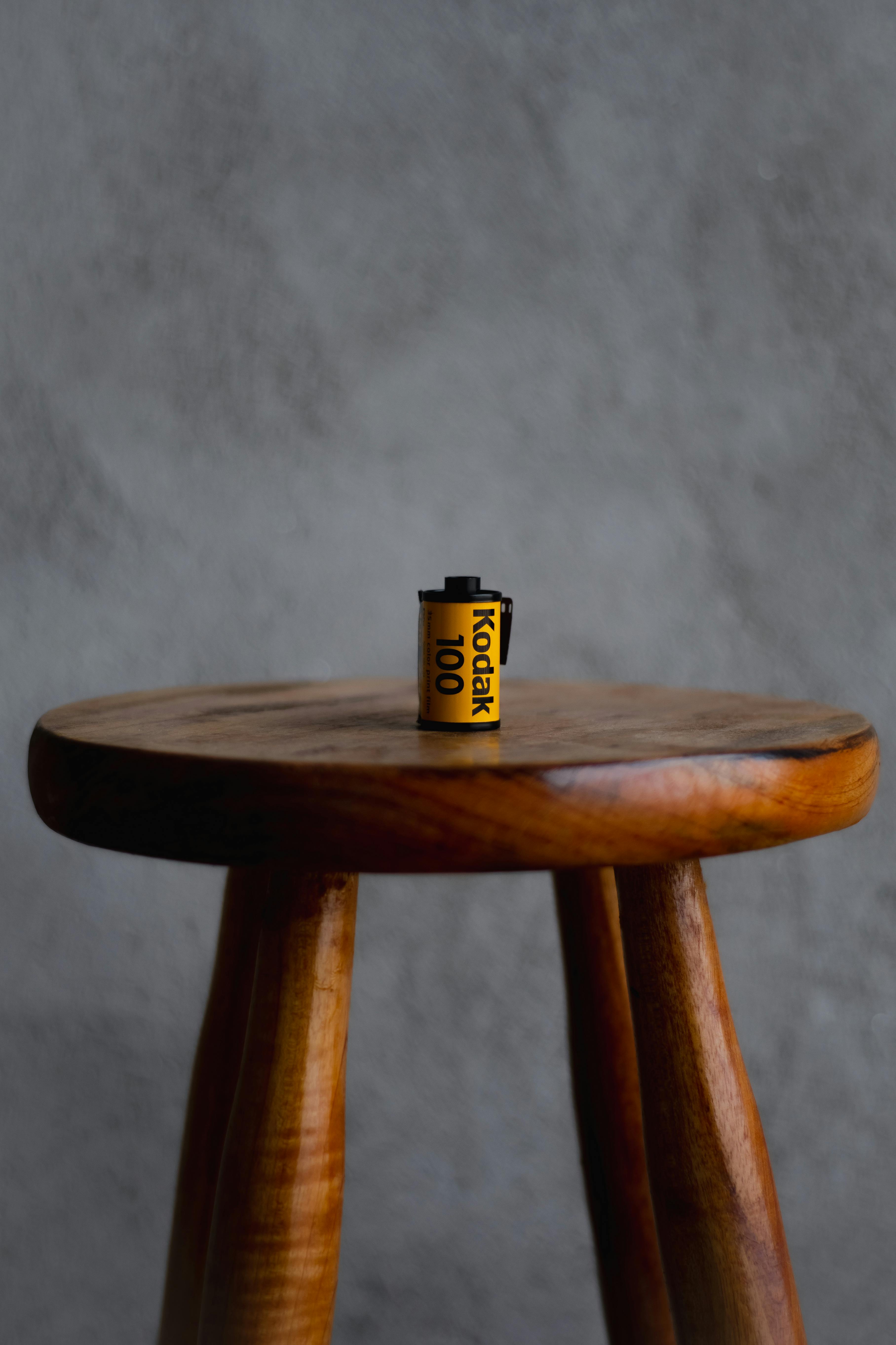 Vintage Film Roll on Wooden Stool Indoors · Free Stock Photo