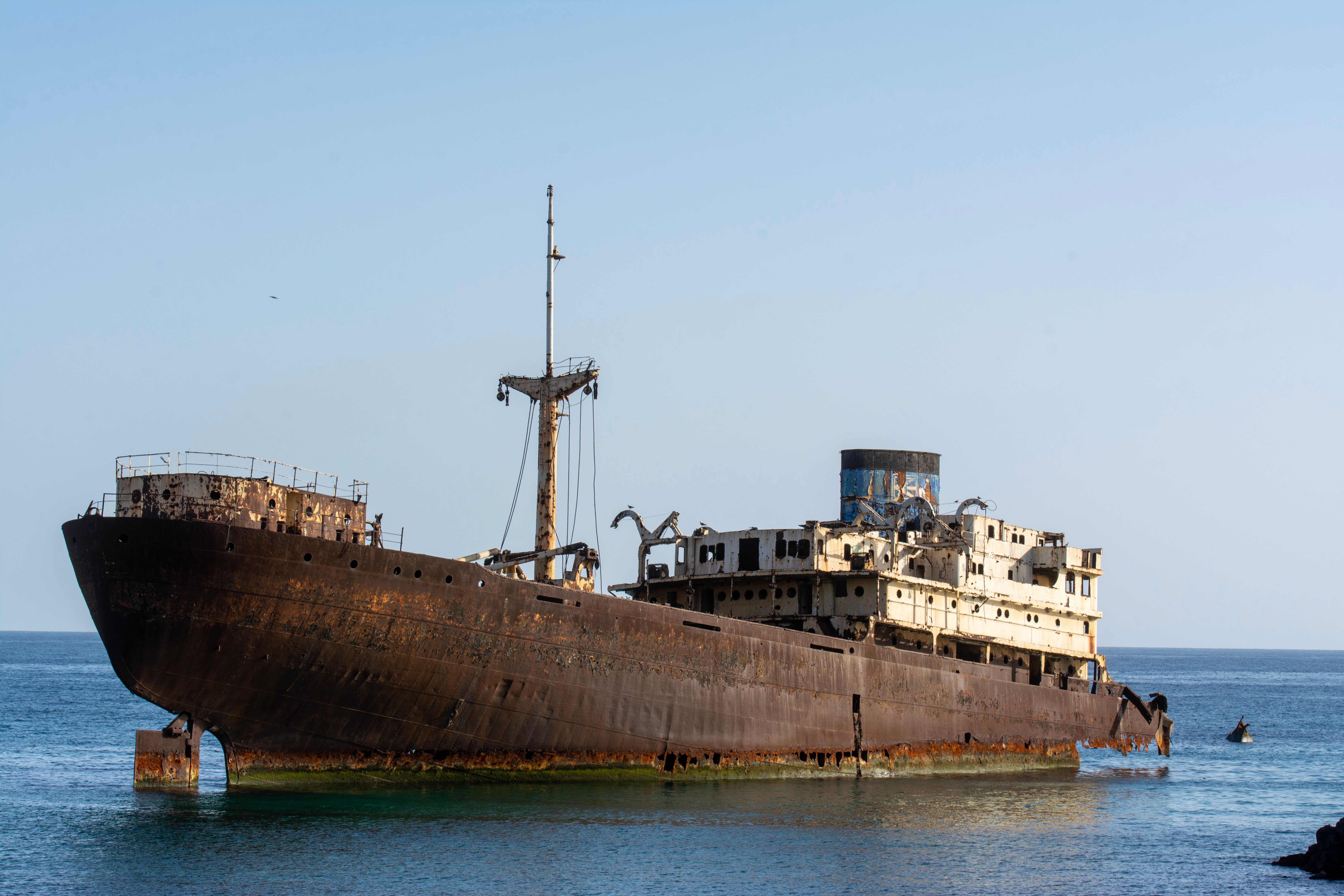 Photo of Old Ship Under Cloudy Sky · Free Stock Photo