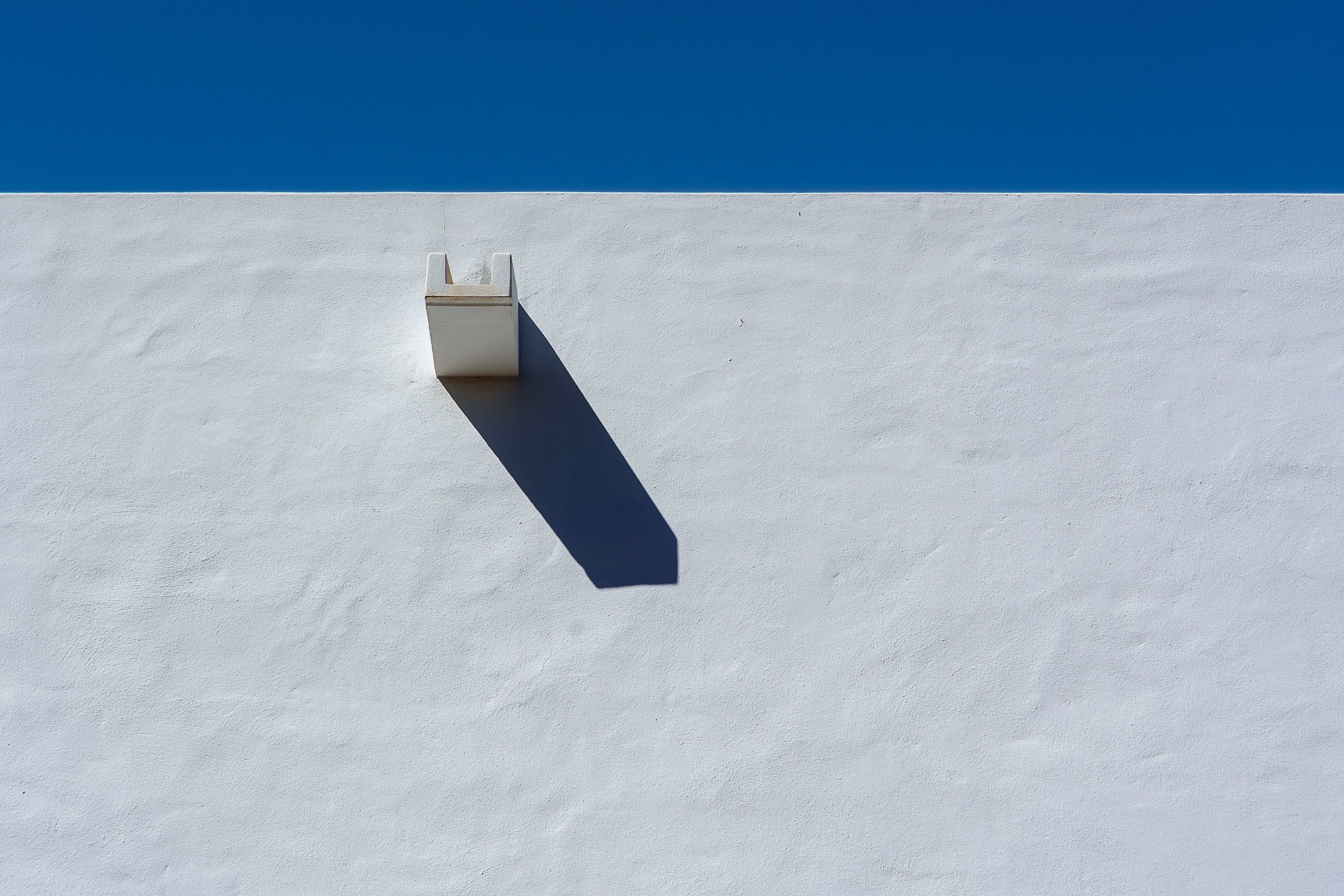 Minimalist Architectural Shadow on White Wall · Free Stock Photo