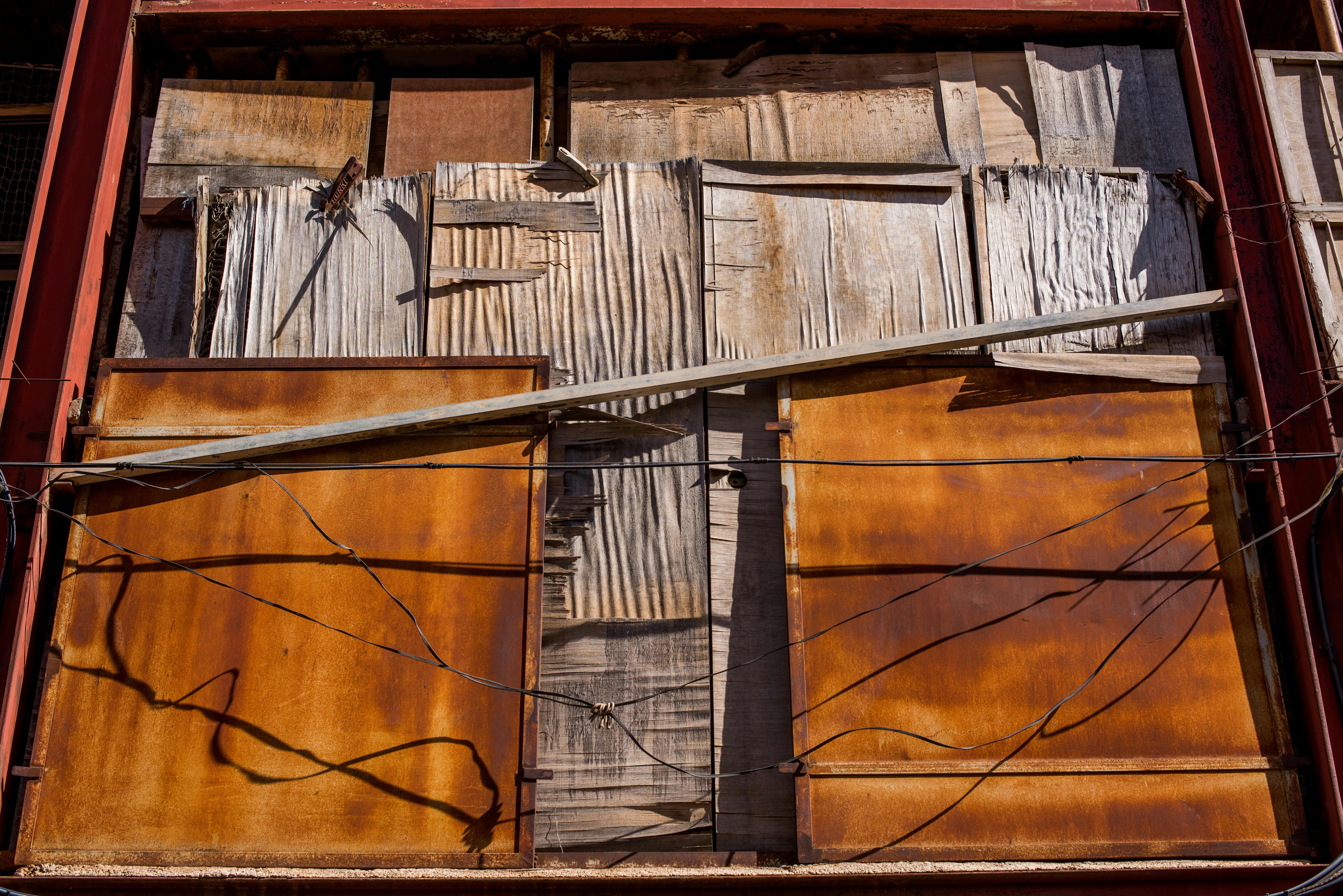 Rustic Industrial Wall with Corroded Metal Panels · Free Stock Photo