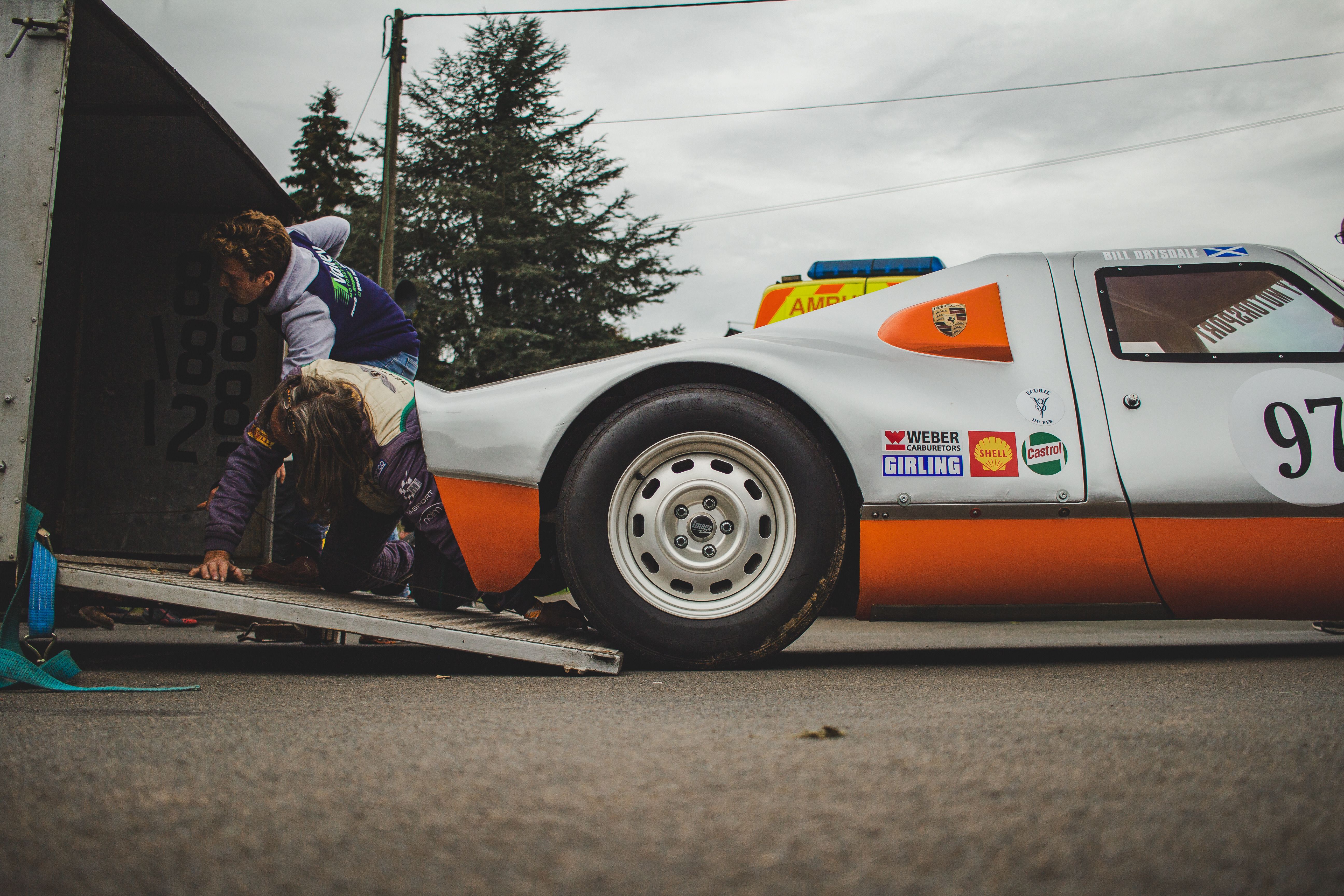 Classic Racing Car Being Loaded for Transportation · Free Stock Photo