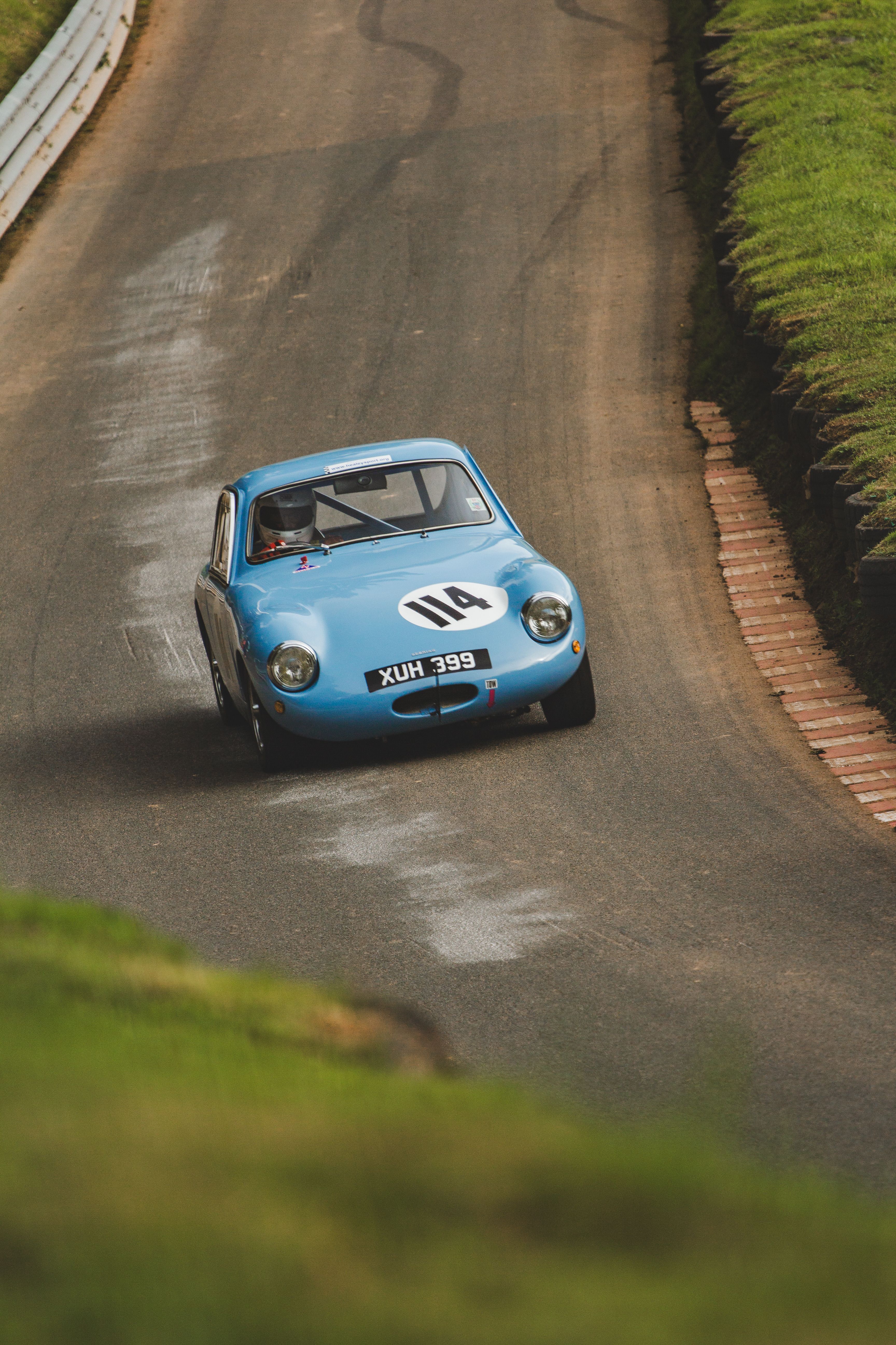 Vintage Blue Race Car on Winding Track · Free Stock Photo