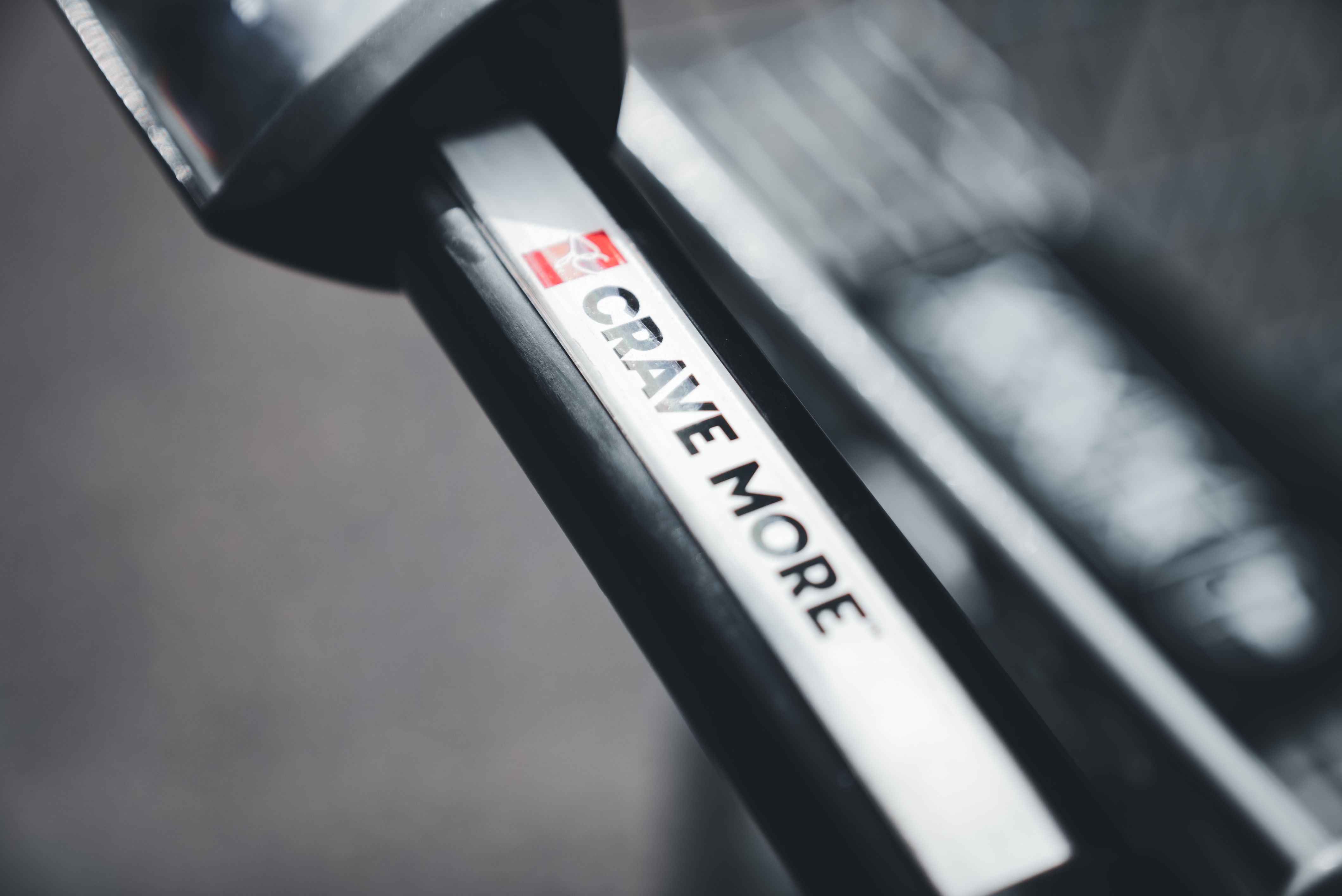 Close-up of Shopping Cart Handle with Branding · Free Stock Photo