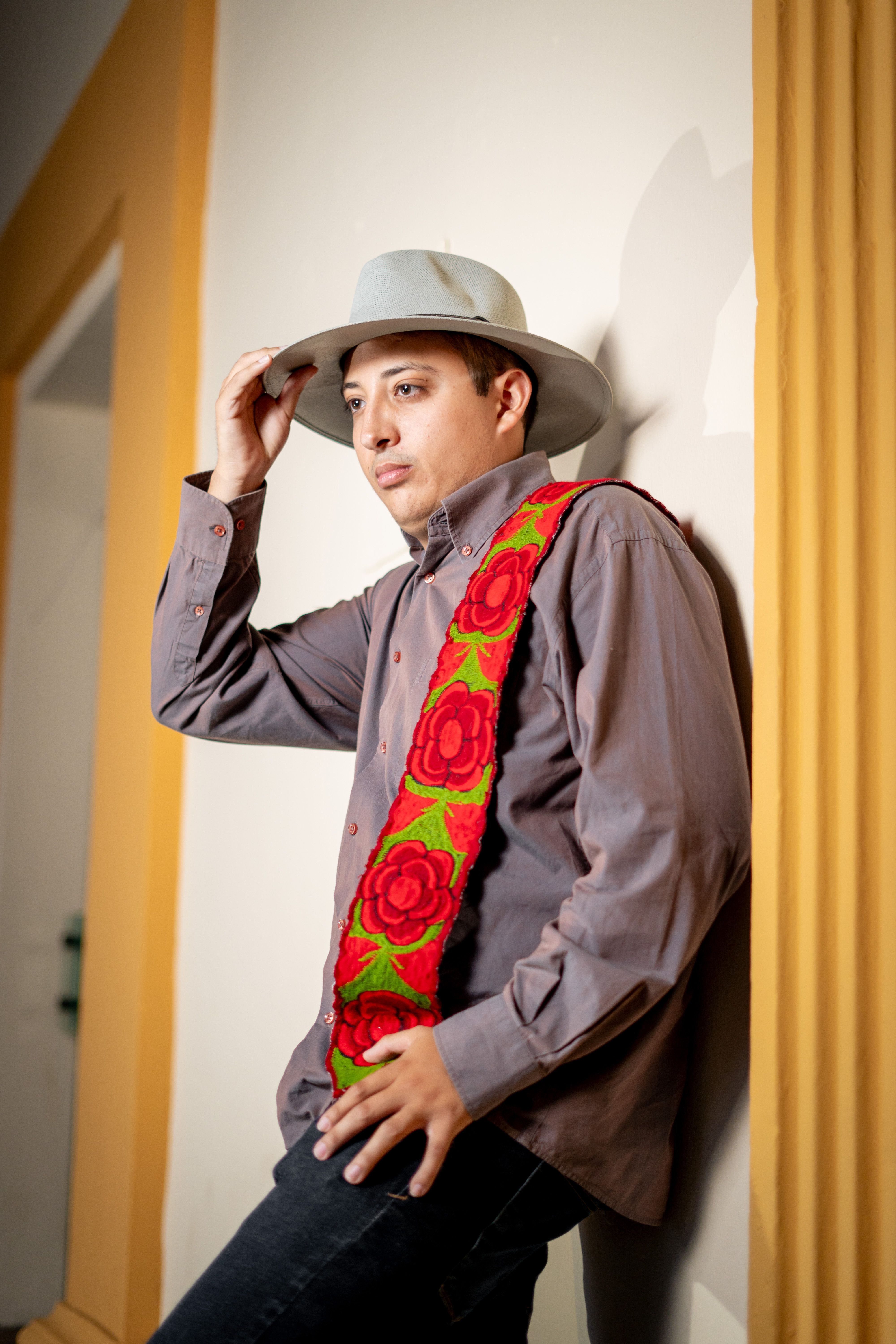 Man in Hat with Colorful Embroidered Sash · Free Stock Photo