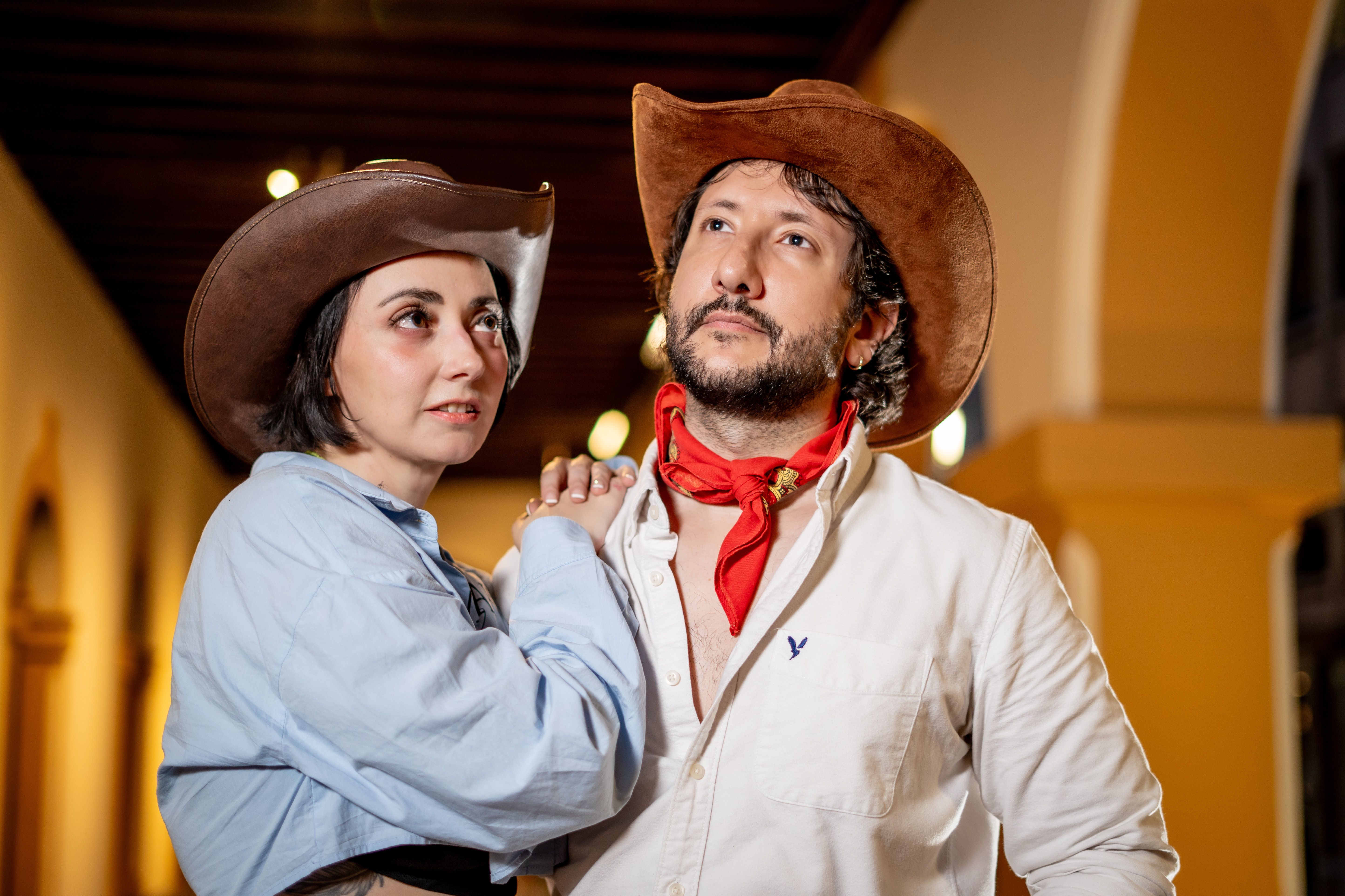 Cowboy Couple in Rustic Indoor Setting · Free Stock Photo