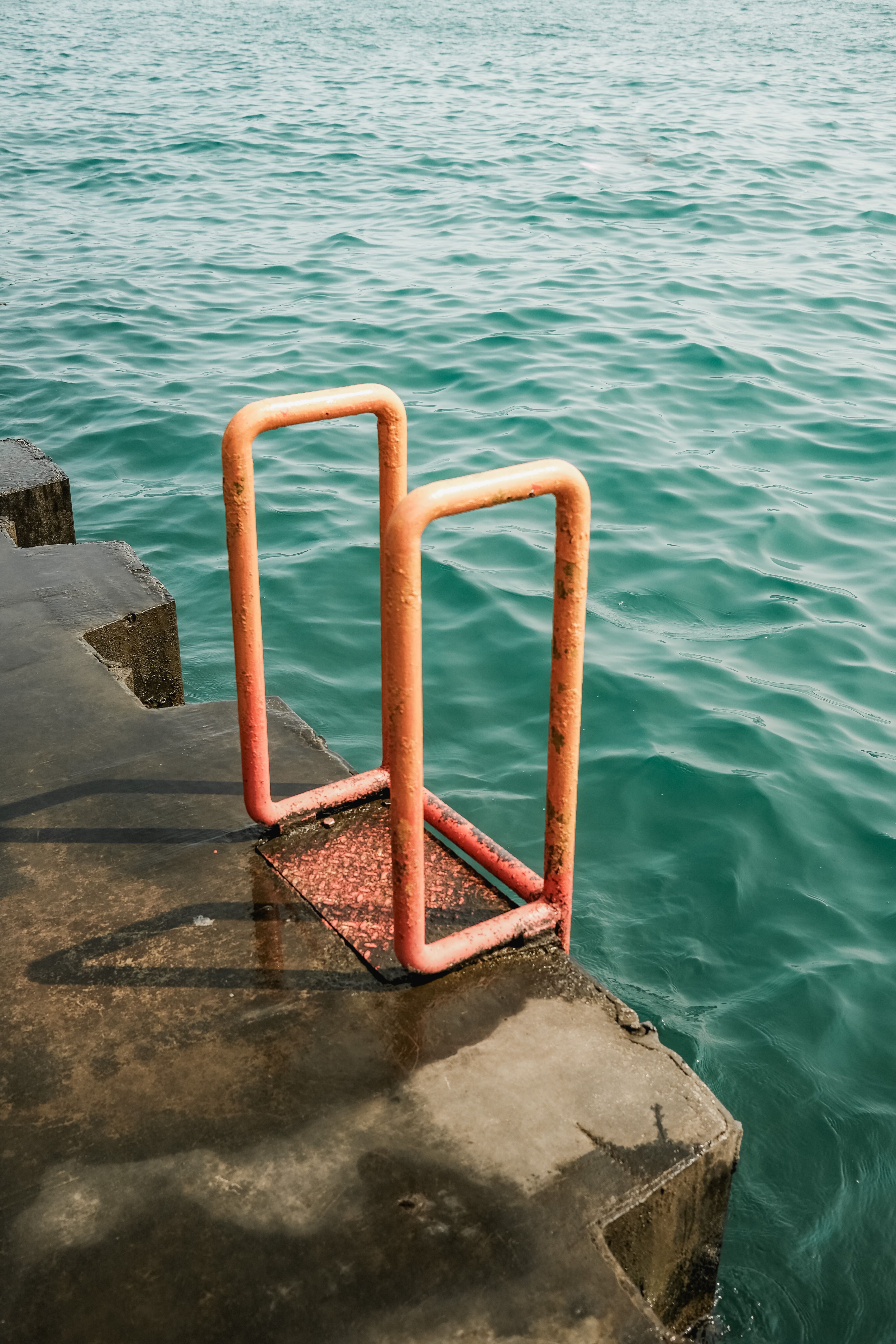 Rusty Metal Ladder by the Turquoise Ocean · Free Stock Photo