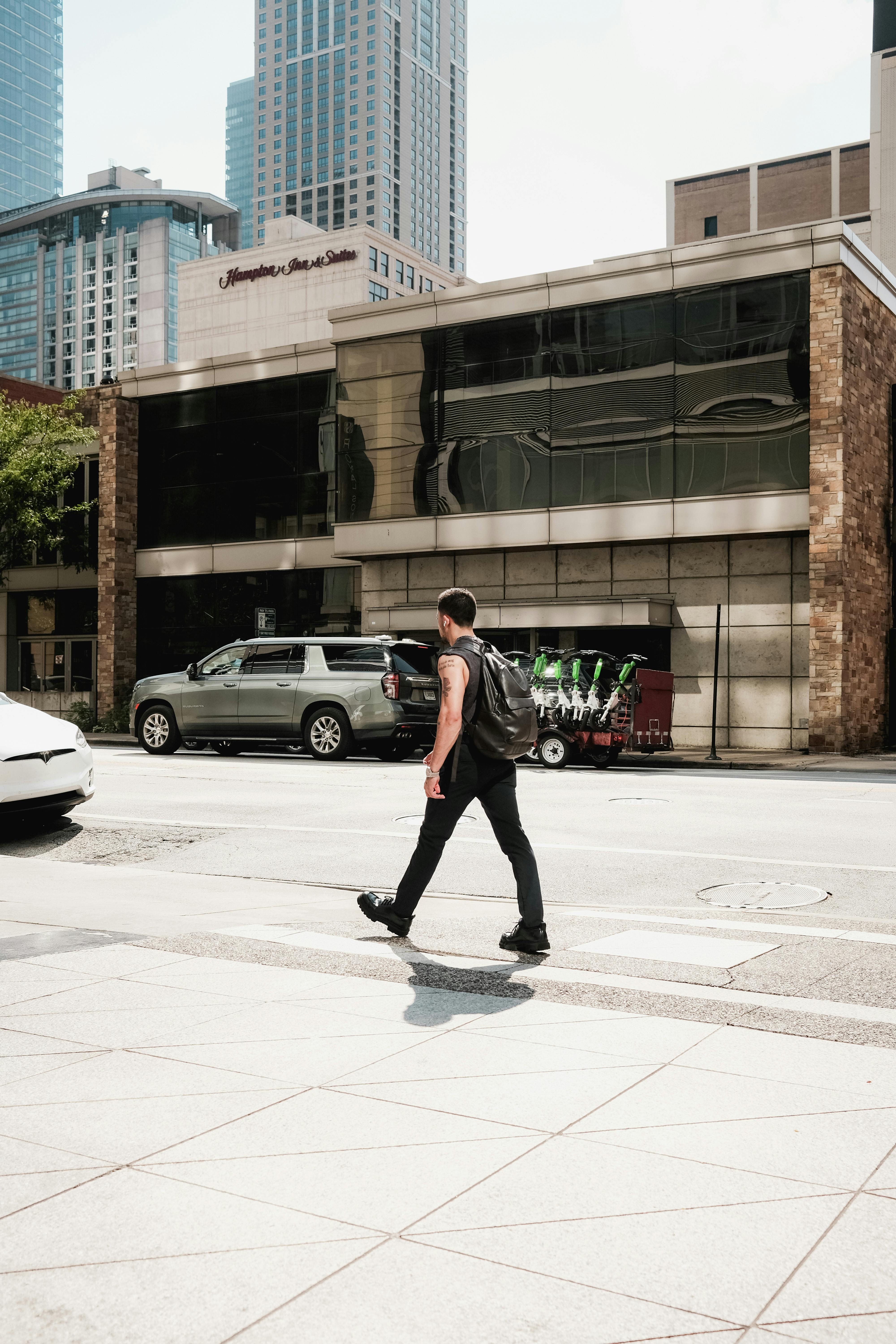 Urban Street Scene with Walking Pedestrian · Free Stock Photo